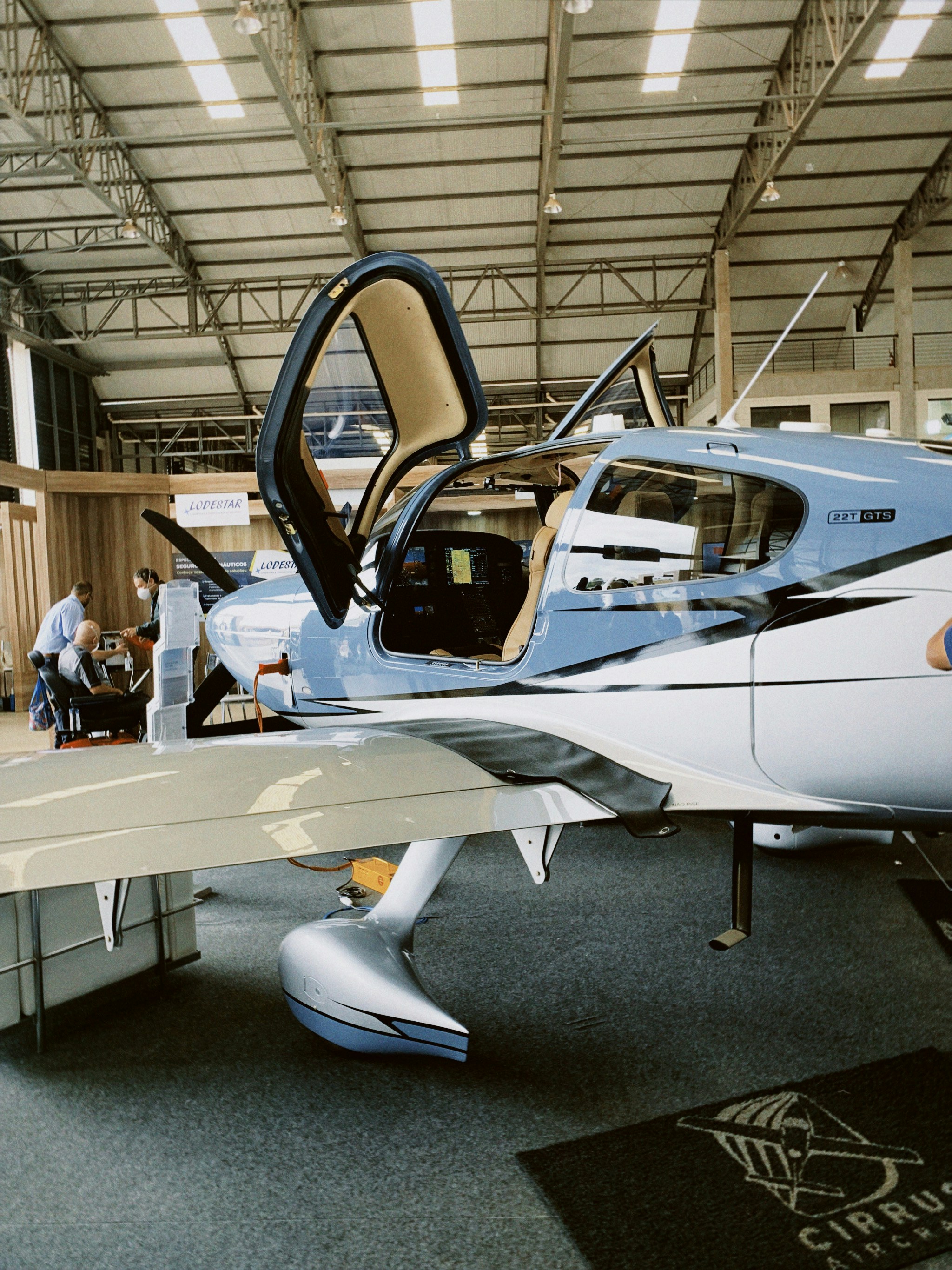 A small airplane sitting inside of a hangar photo – Free Airplane Image ...