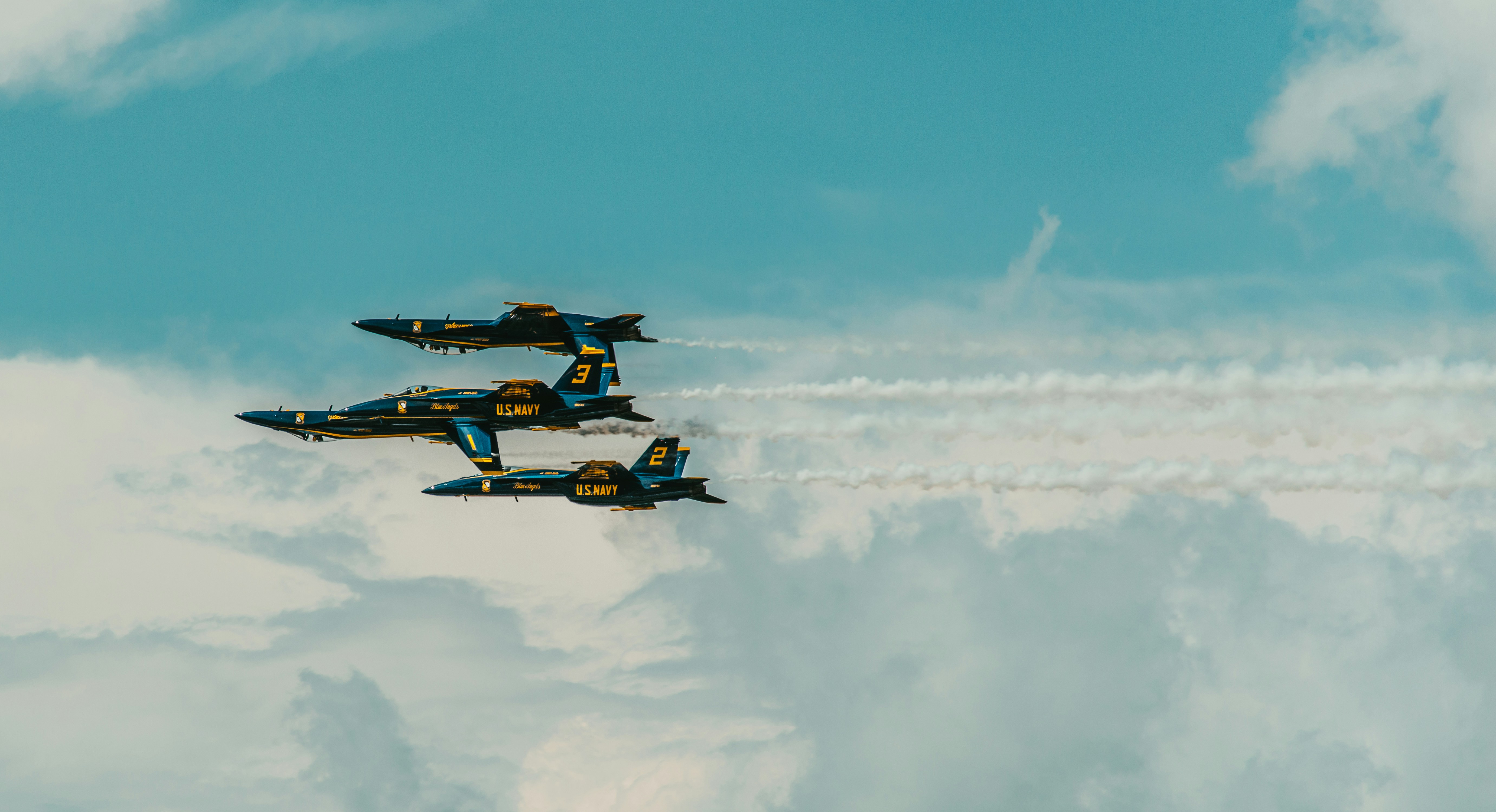 Tri-Jet silhouettes carving through cerulean skies