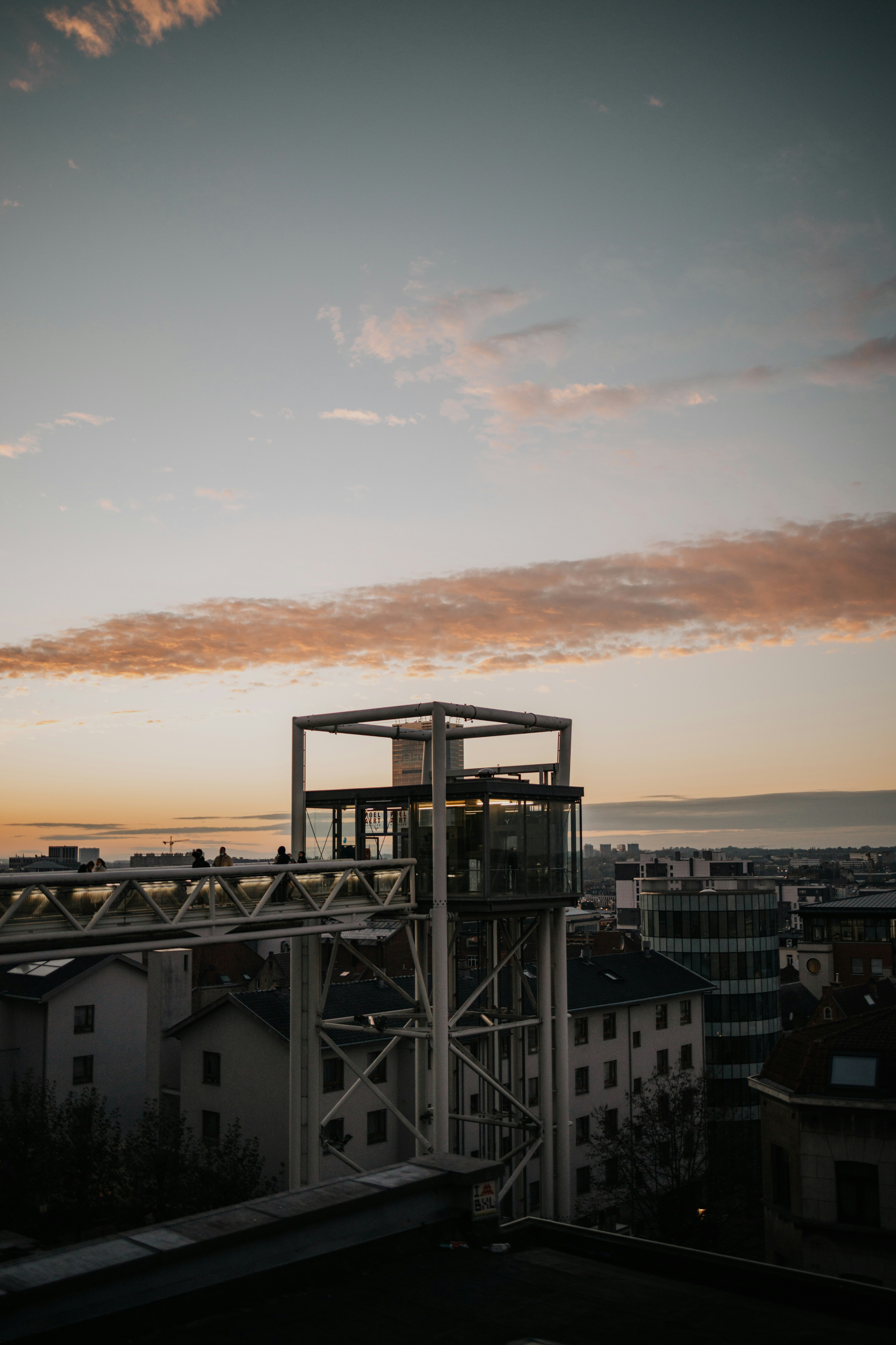 Rooftop Frame: Evening Structure Against a Quiet City Horizon