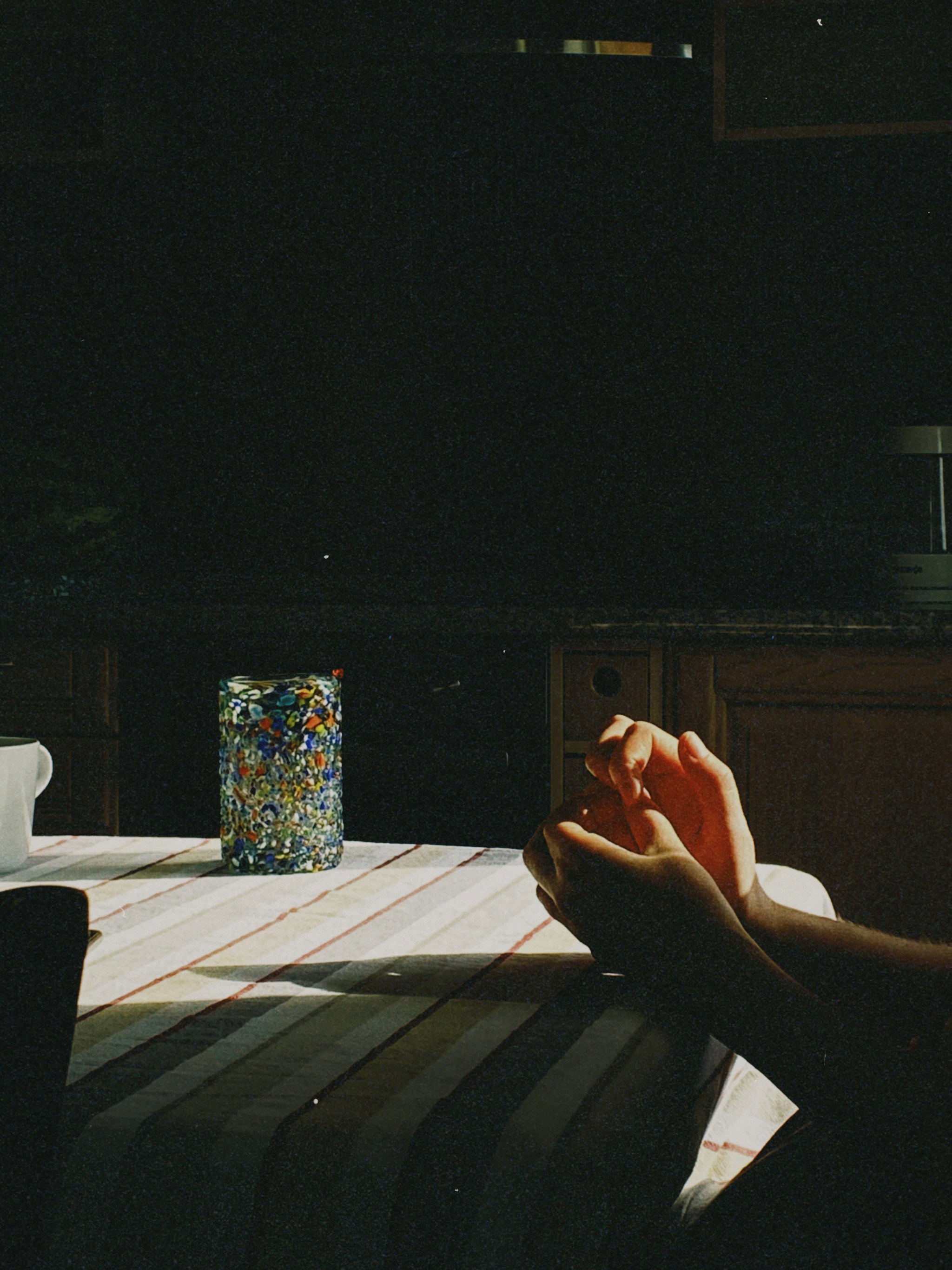 A person sitting at a table in the dark photo – Free Kyiv Image on Unsplash