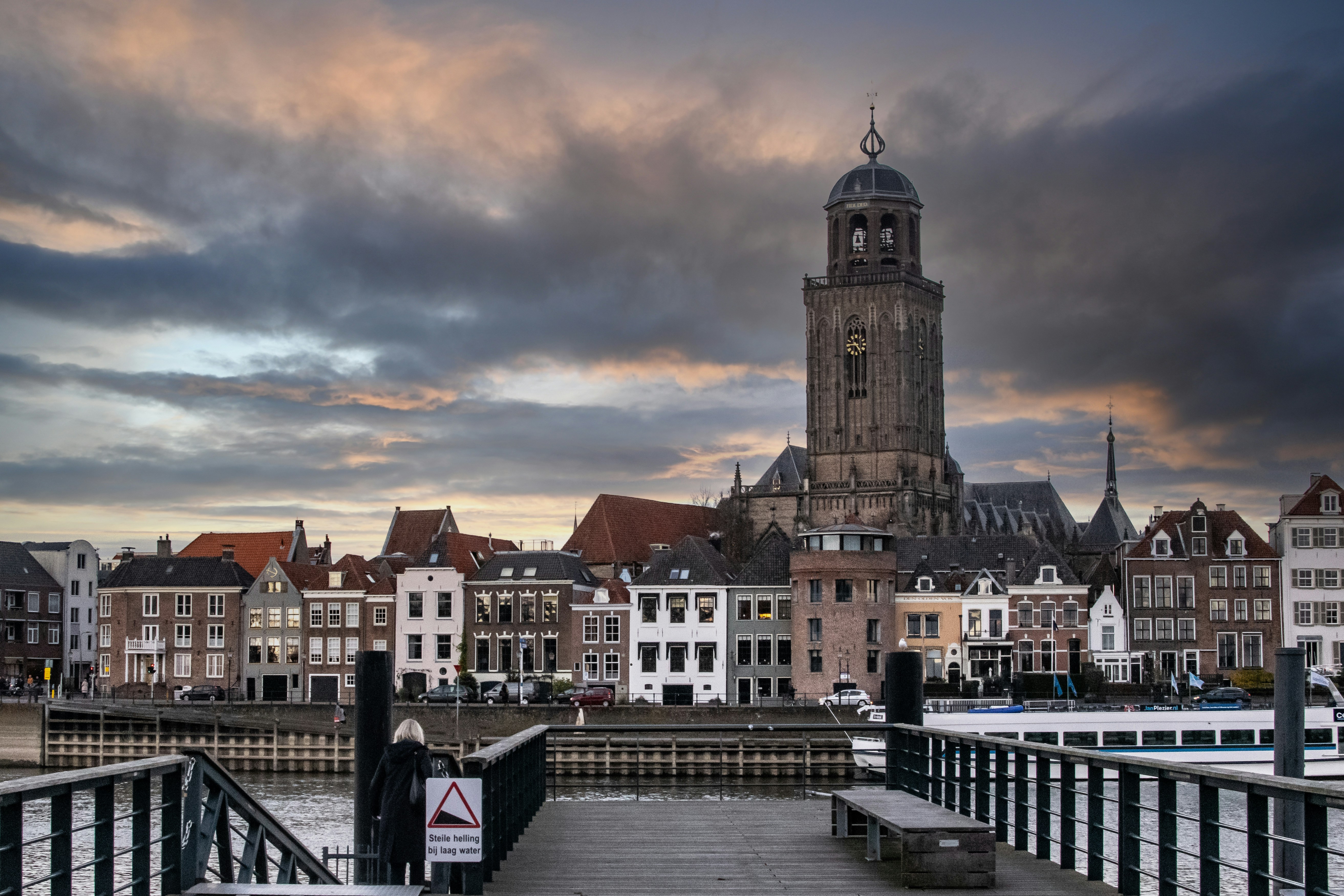 A large clock tower towering over a city photo – Free City buildings ...