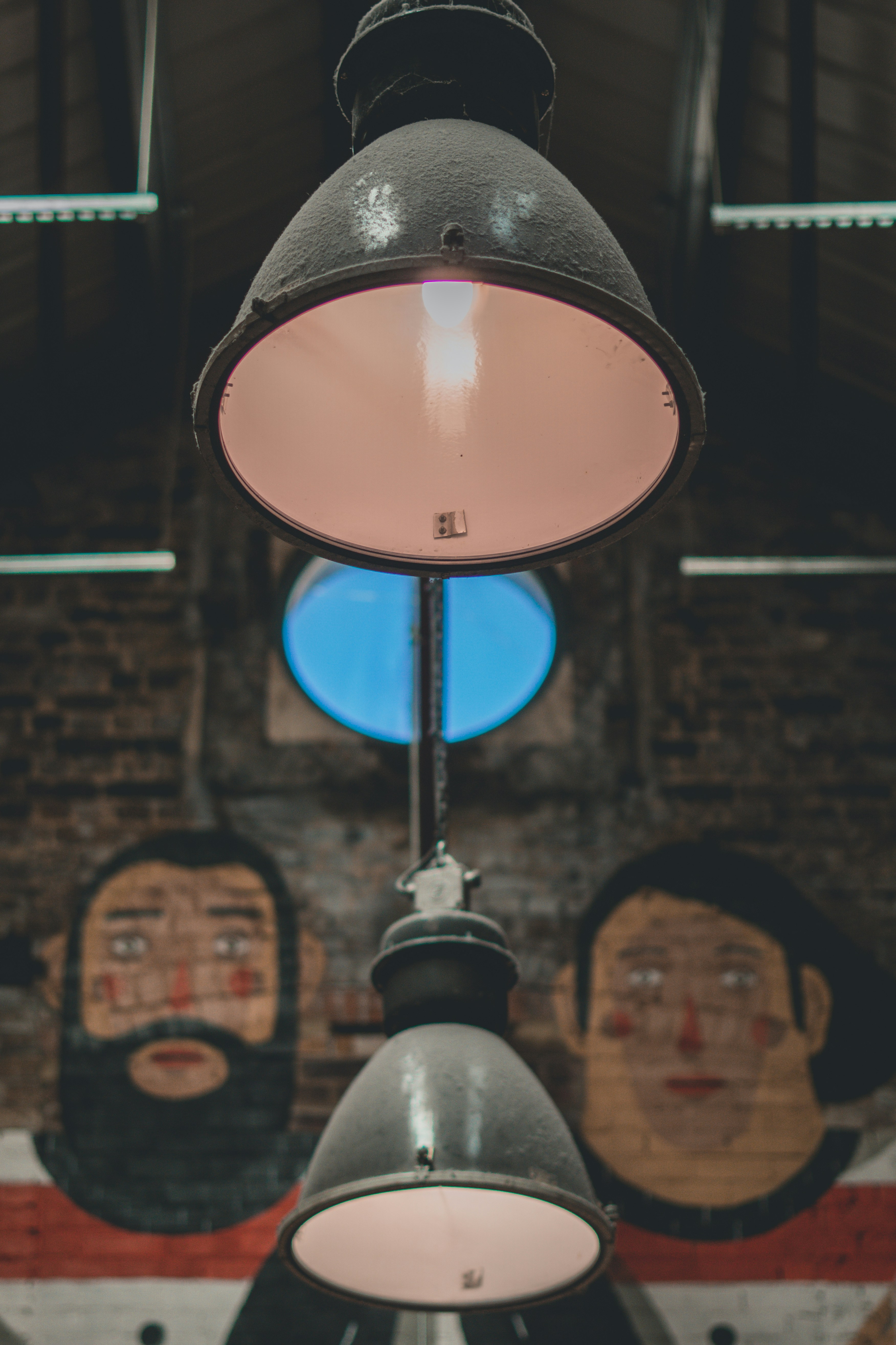 Hanging Constellations Over a Brick-Walled Mural