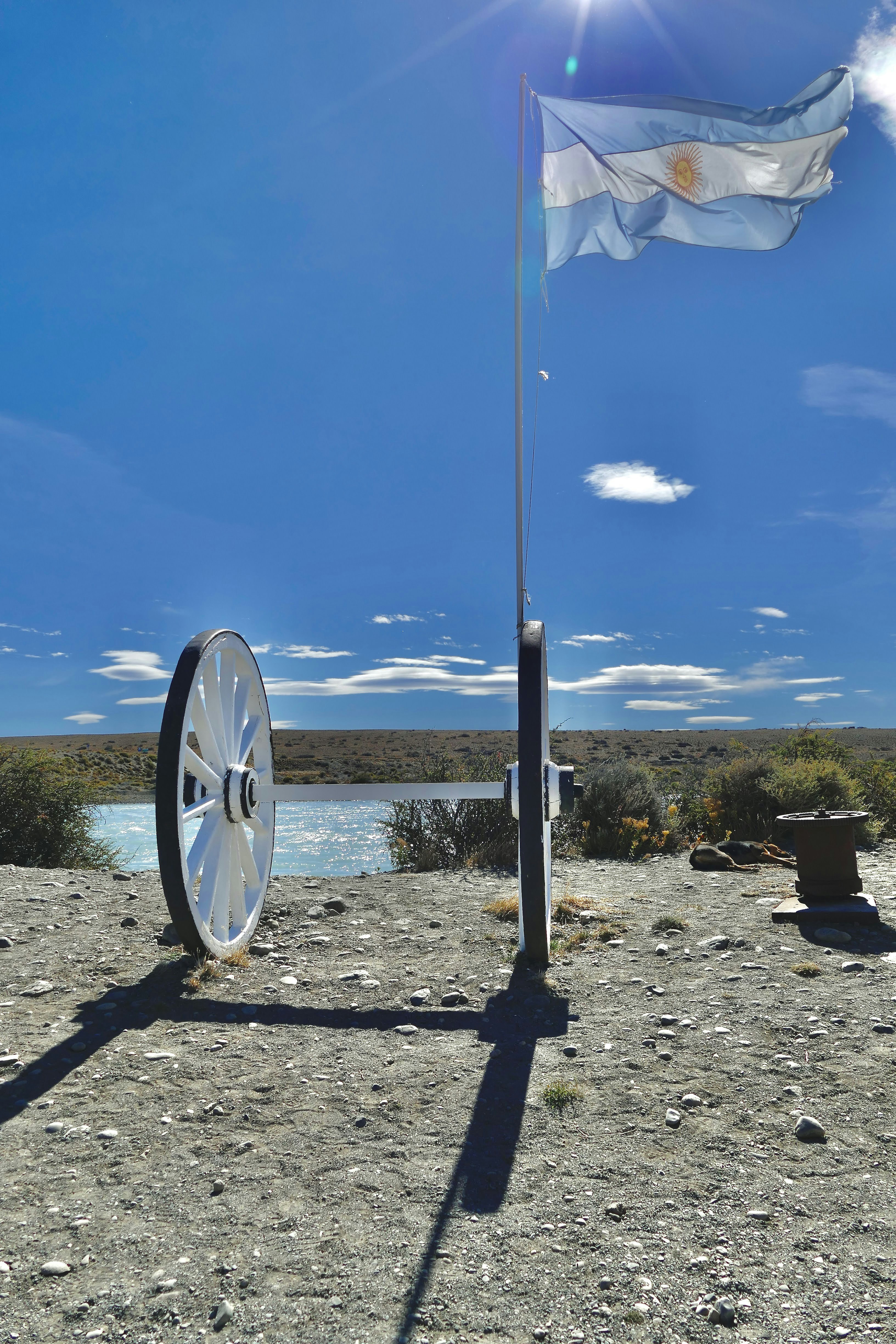 a flag is flying next to a wheel