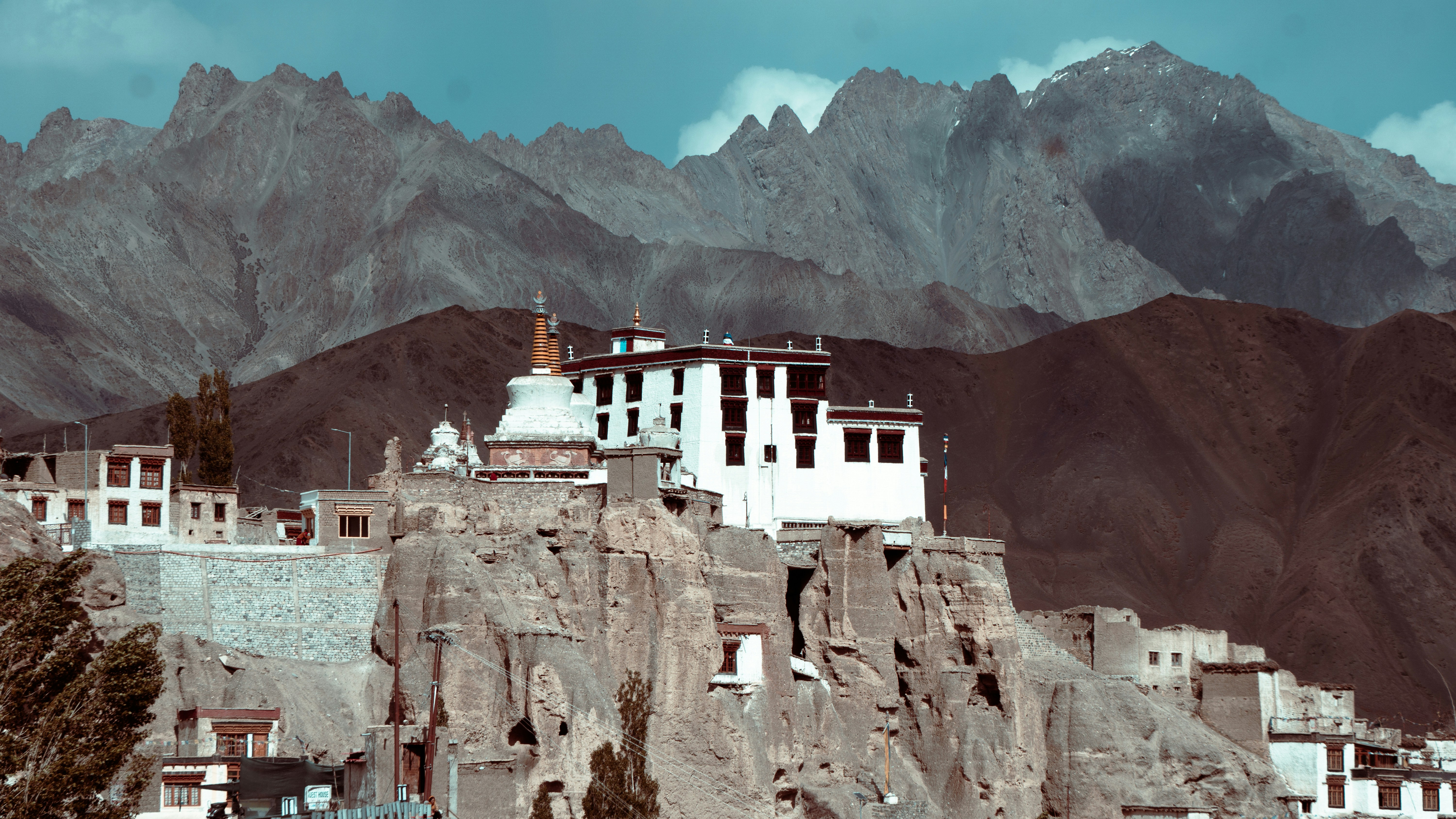 Tiger's Nest Monastery Clings to Bhutanese Cliff Face Under Alpine Skies