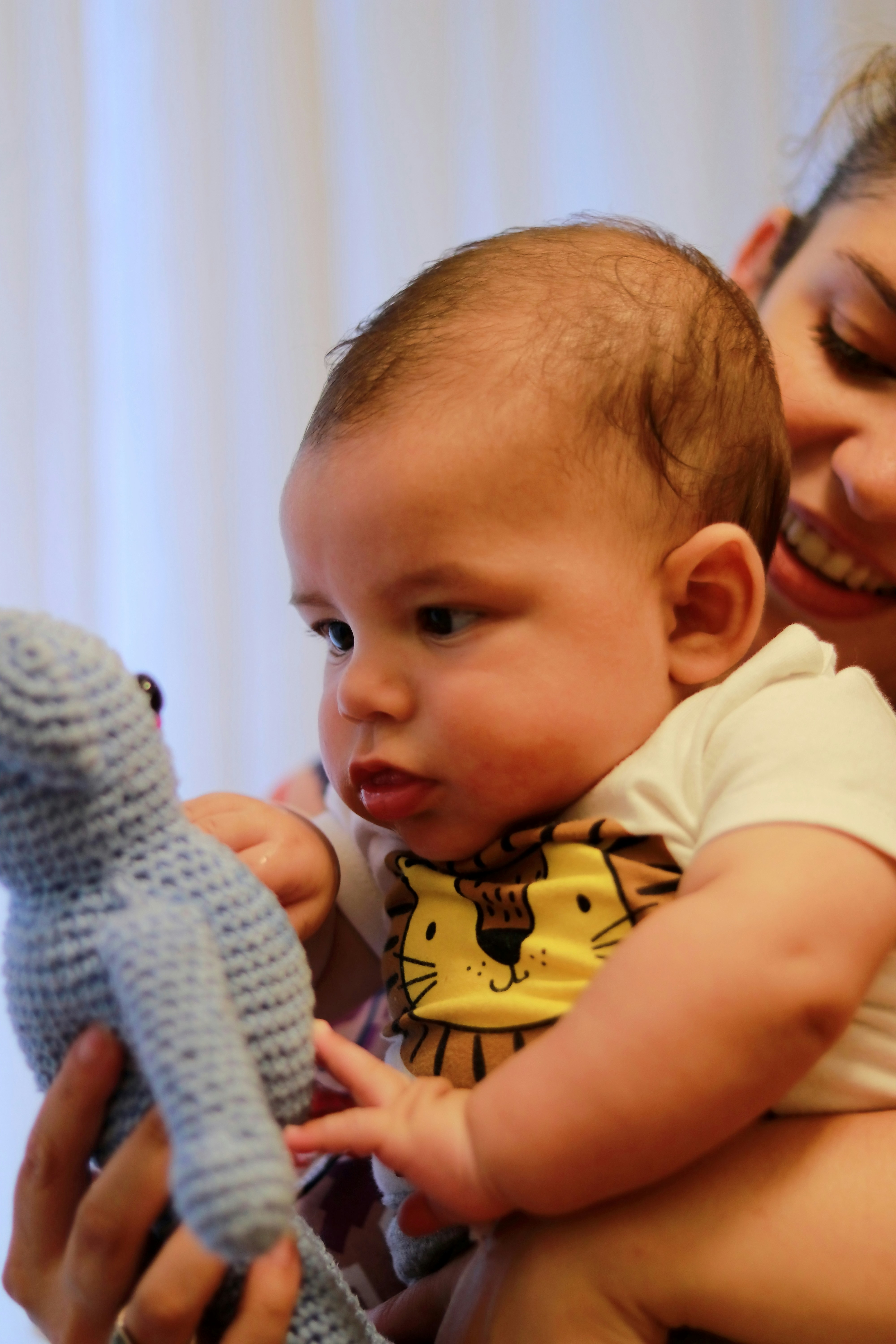 Tender Moment: Baby Meets a Soft Knit Toy