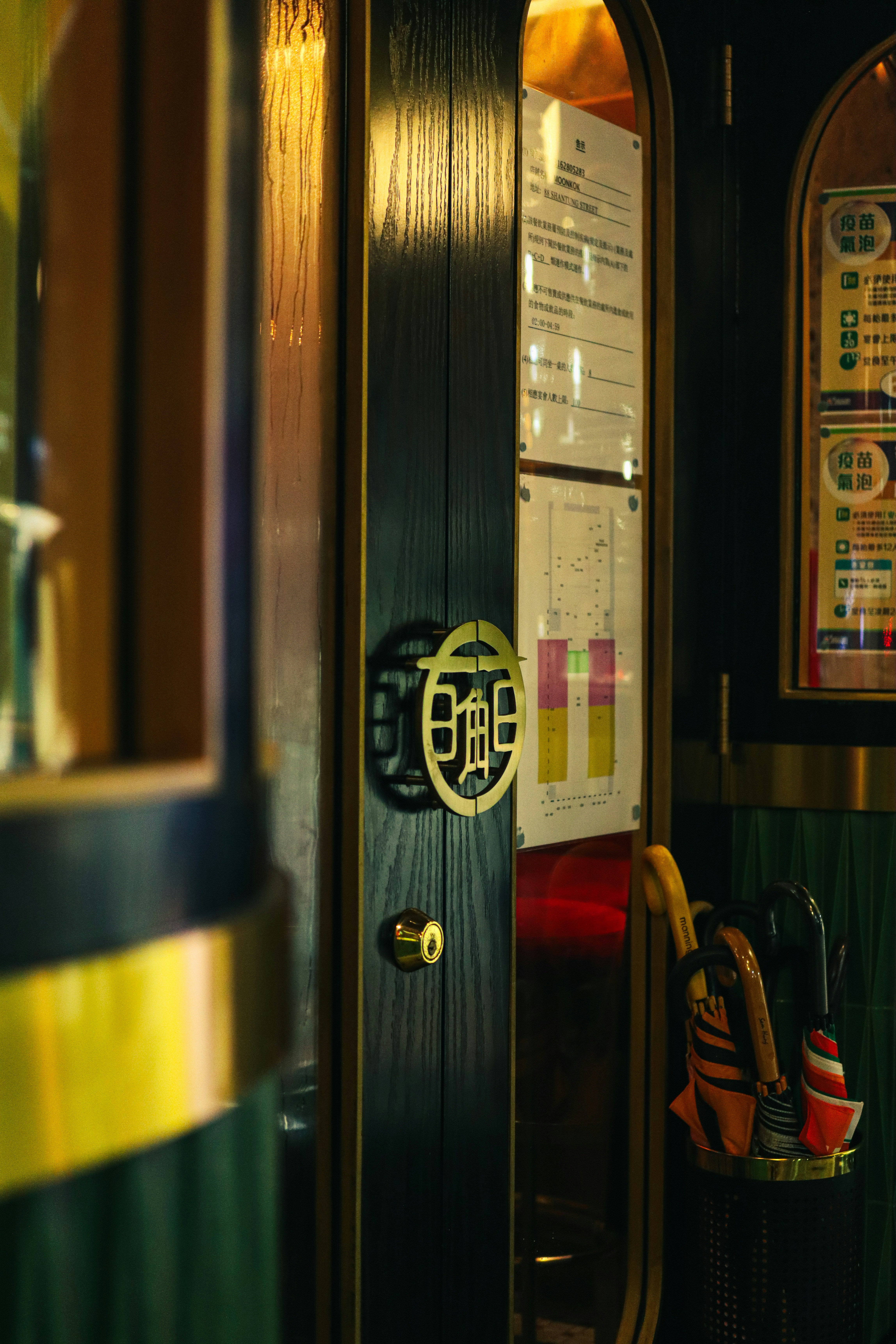 Warm-glow doorway with a circular crest in a quiet transit cabin