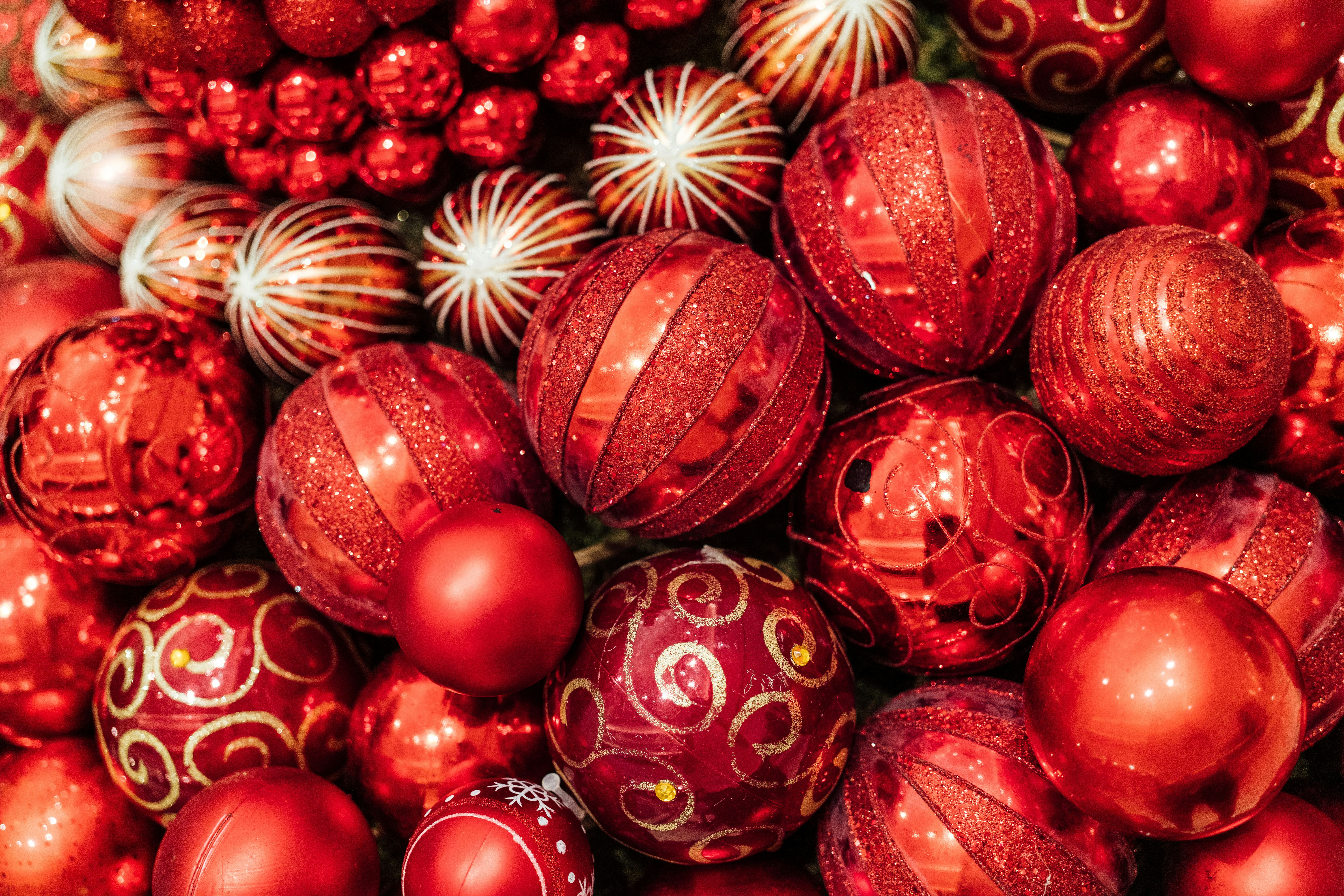 A pile of red and gold christmas ornaments photo – Free Ornament Image ...