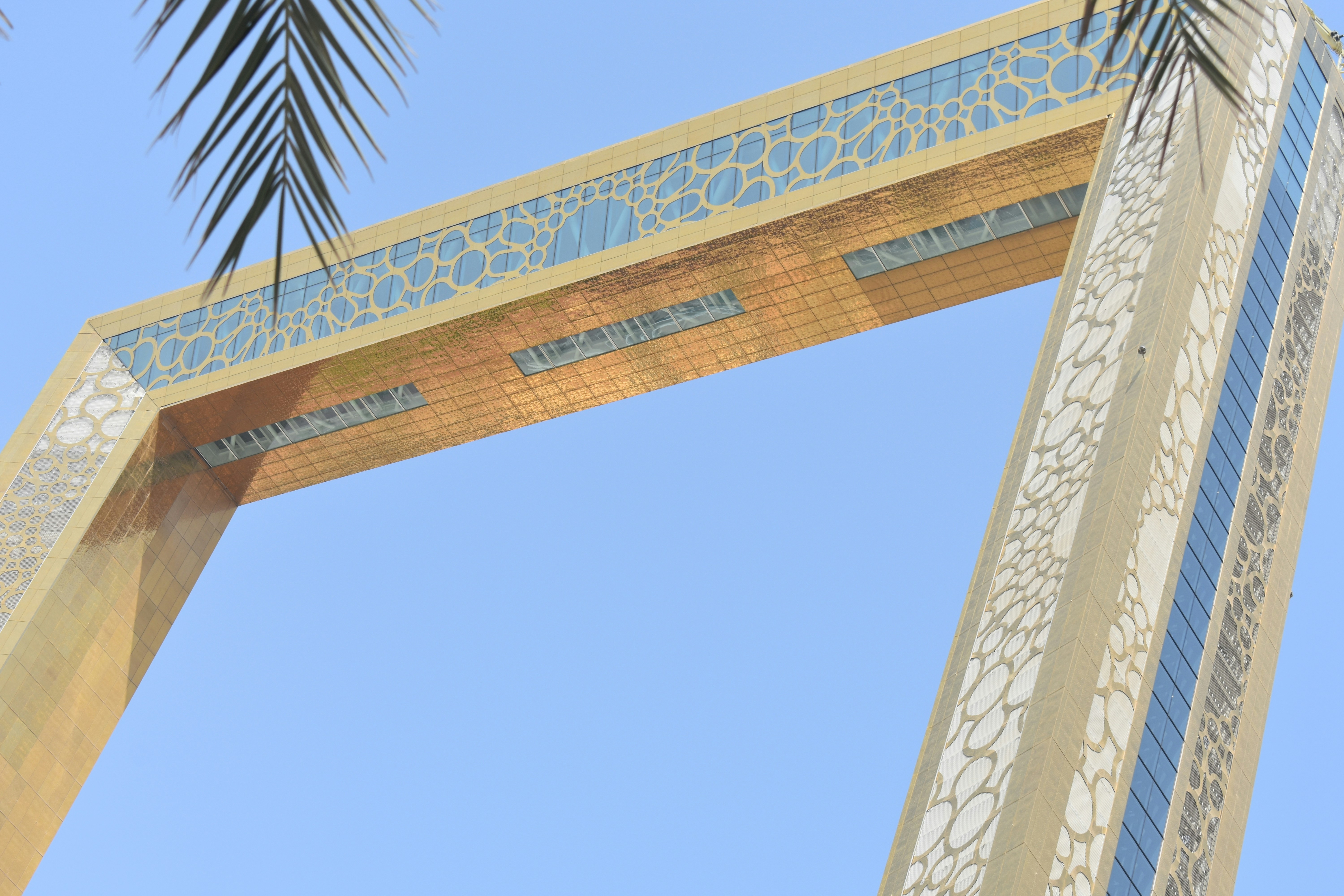 Sun-Kissed Lattice Gateway Against a Cerulean Sky