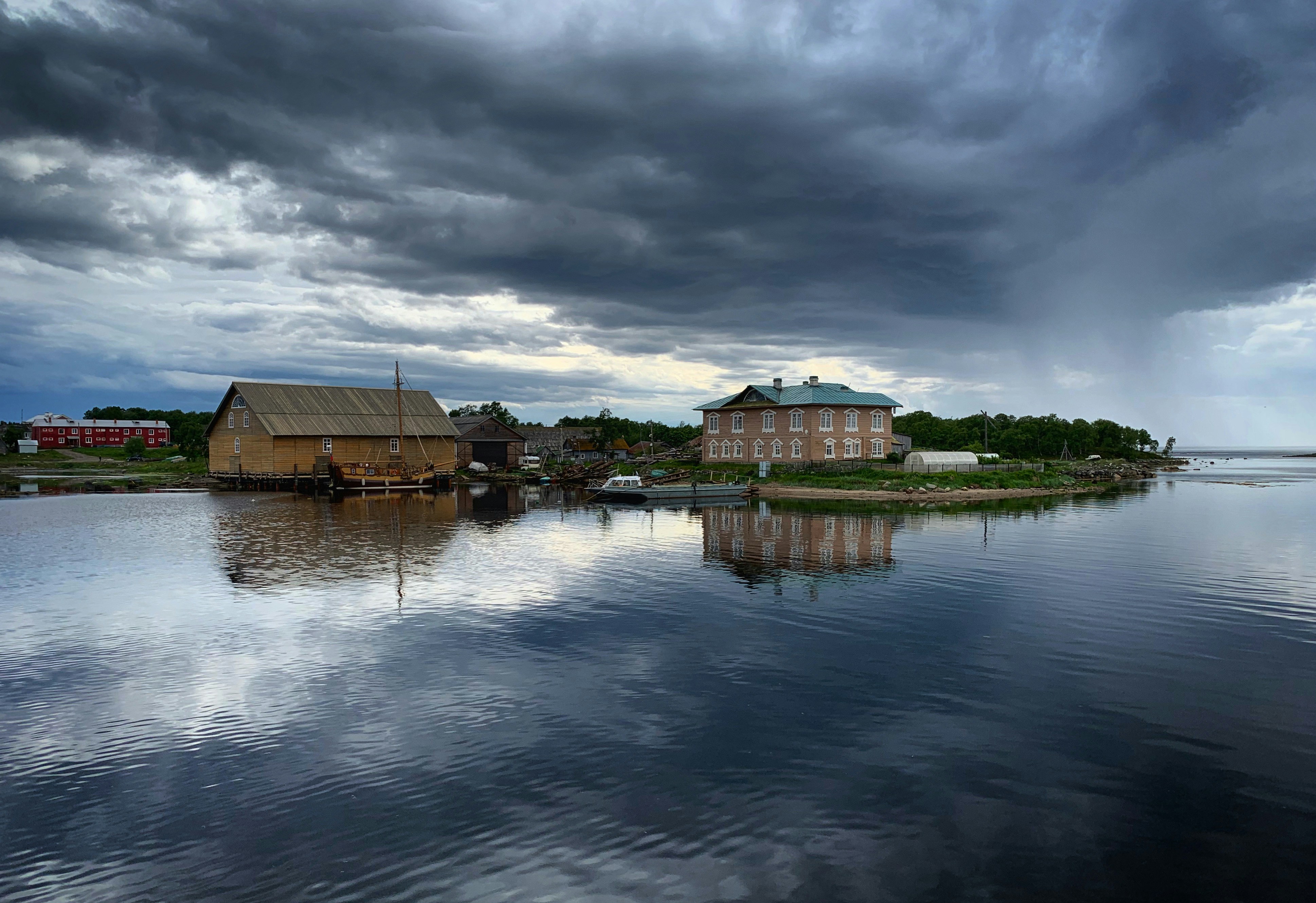 Harborline Reflections under a Storm-Gray Sky