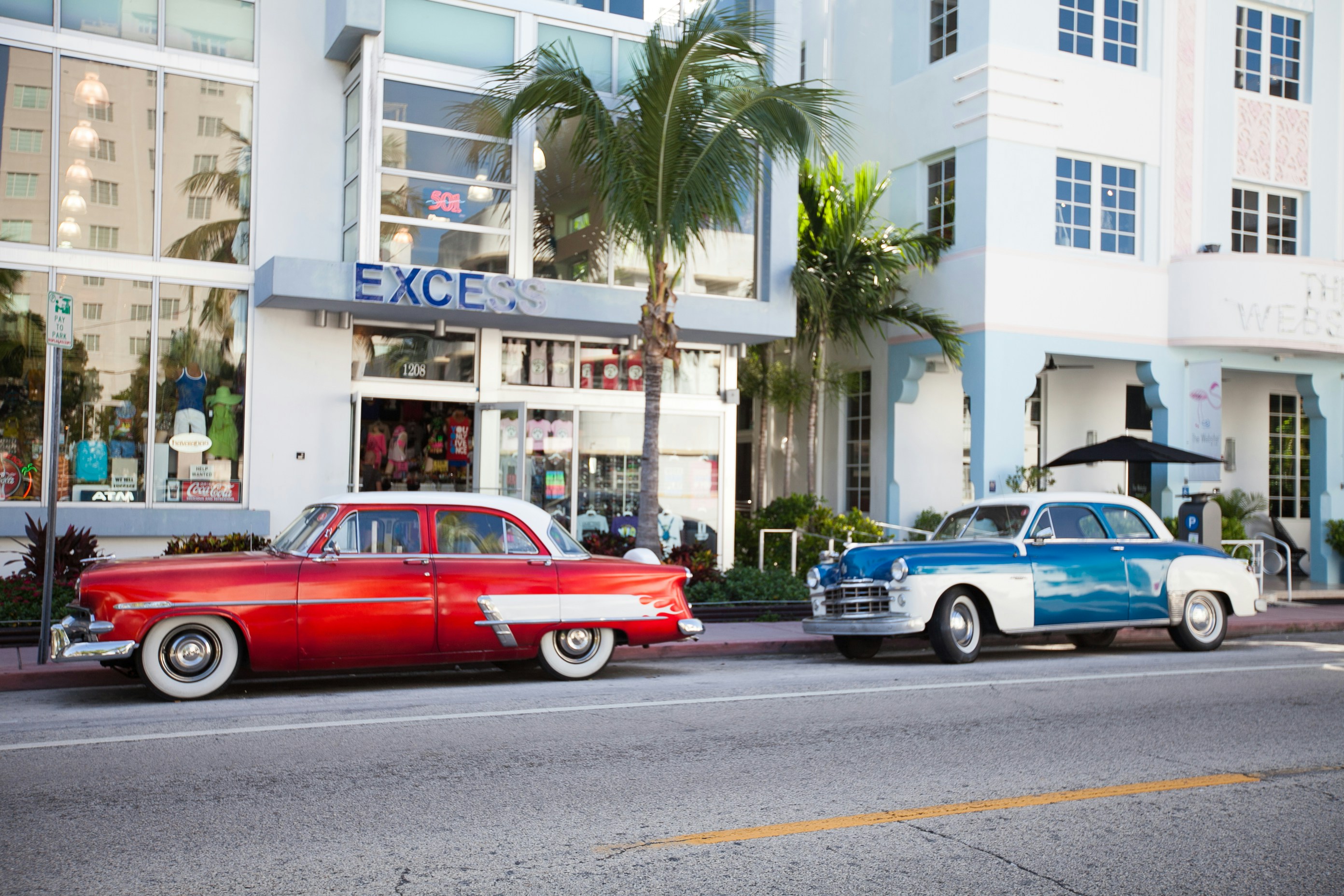 Two classic cars parked on the side of the road photo – Free Miami ...