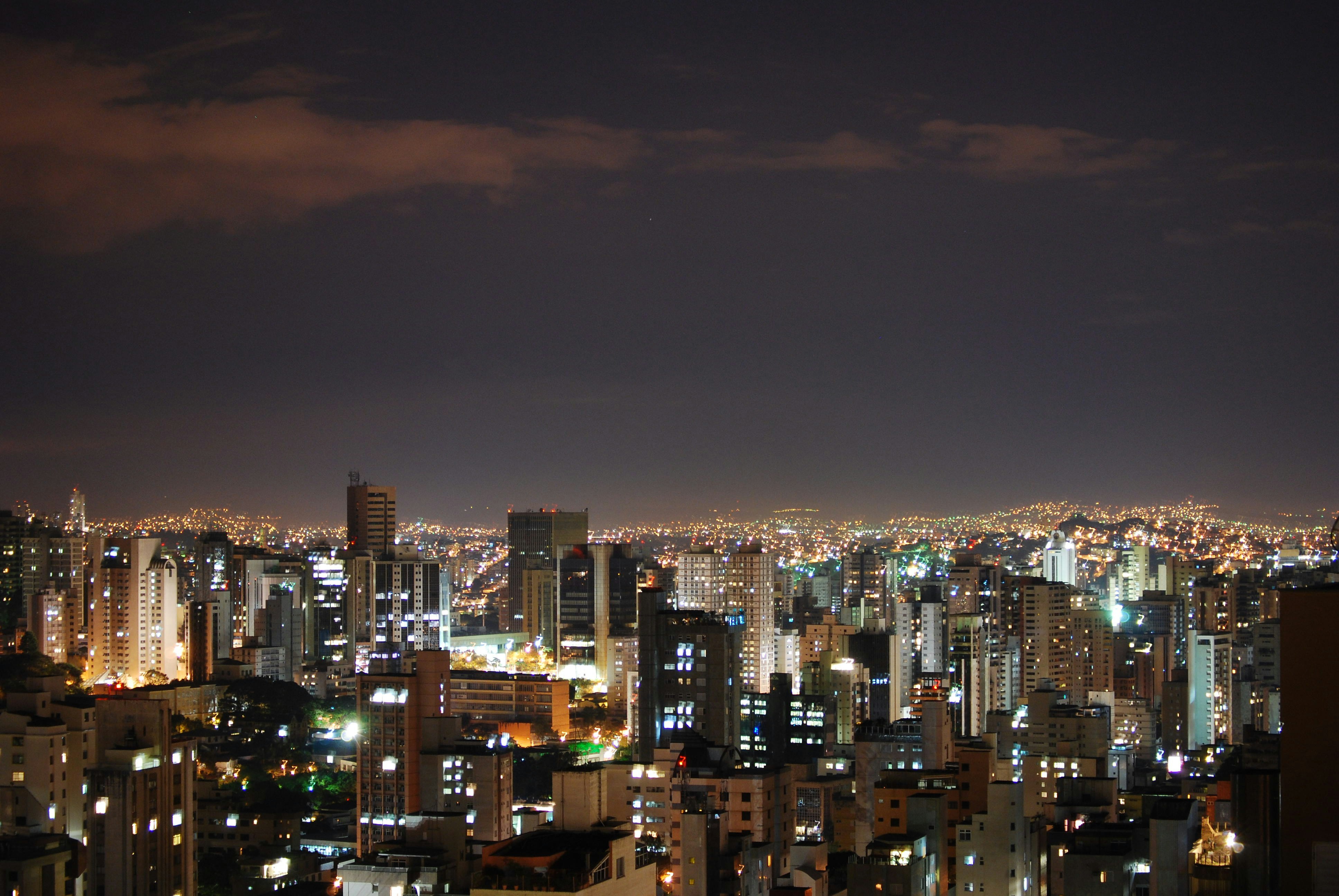 City Lights | a city at night with a lot of tall buildings