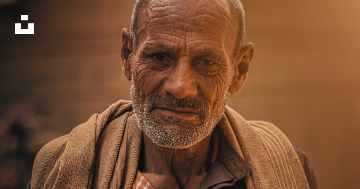 An Old Man With A Scarf Around His Neck Photo Free Portrait Image On