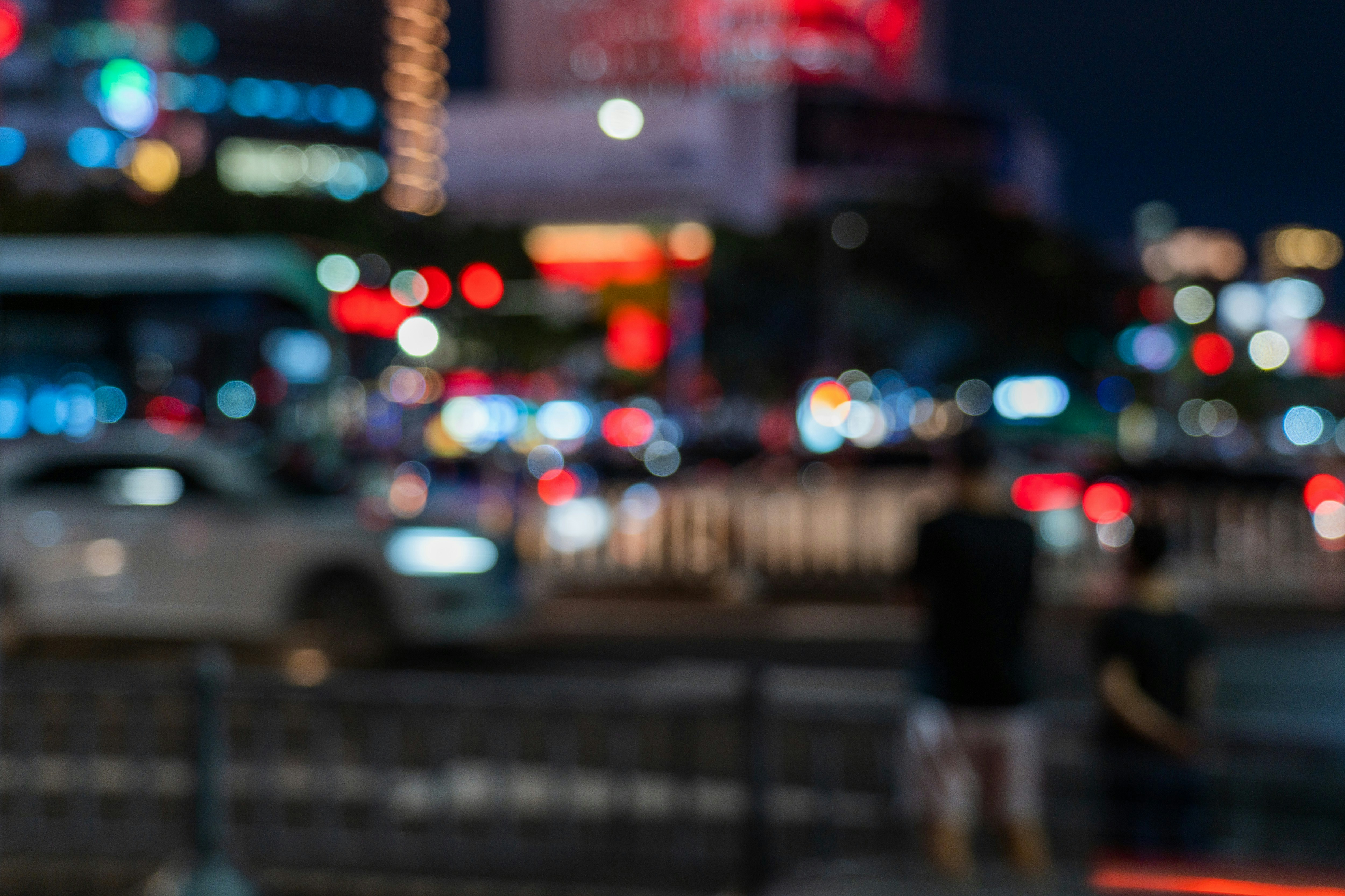 a blurry photo of a city street at night