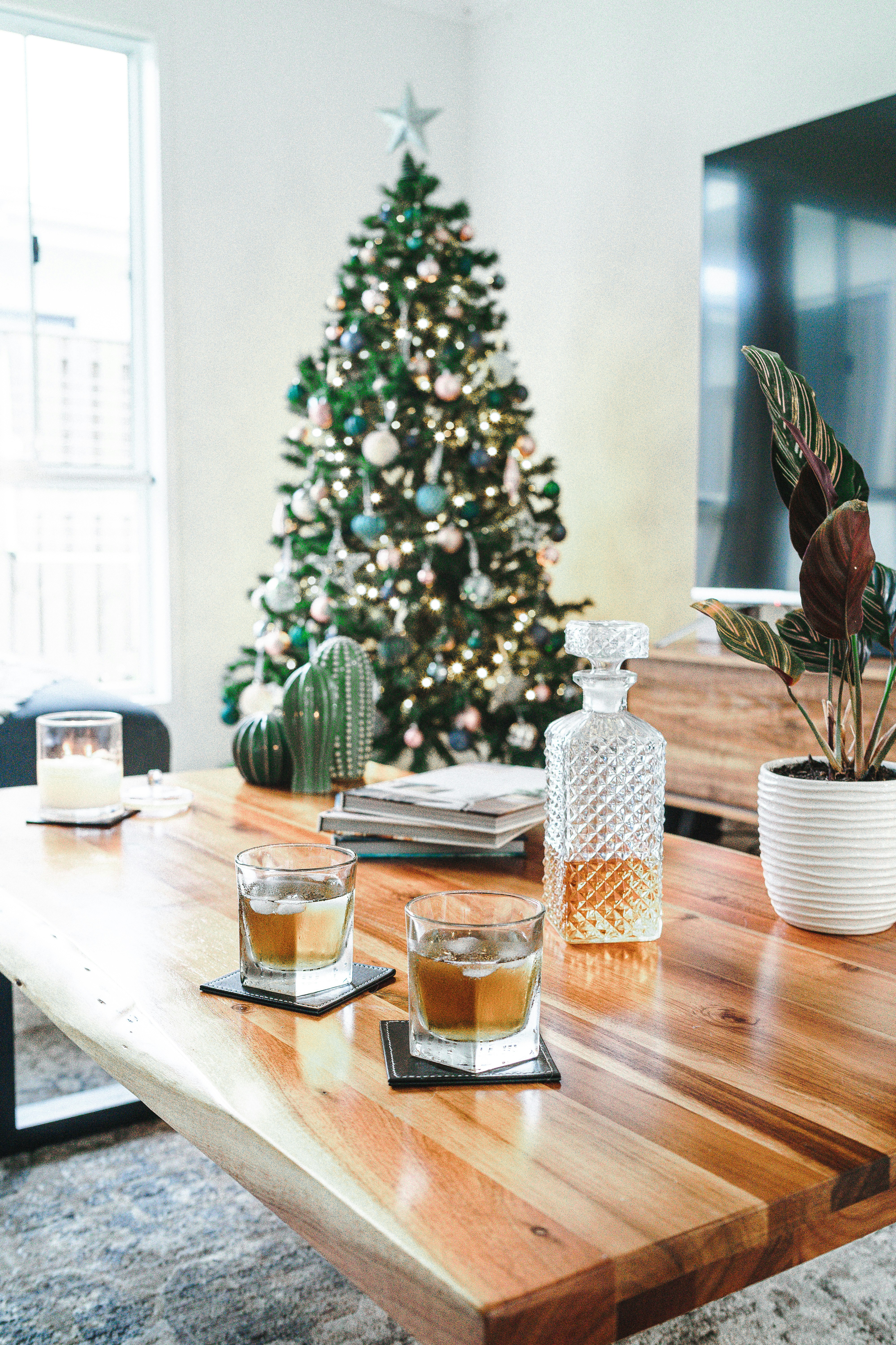 Holiday Glow on the Wood Table: Drinks, Decor, and a Christmas Tree
