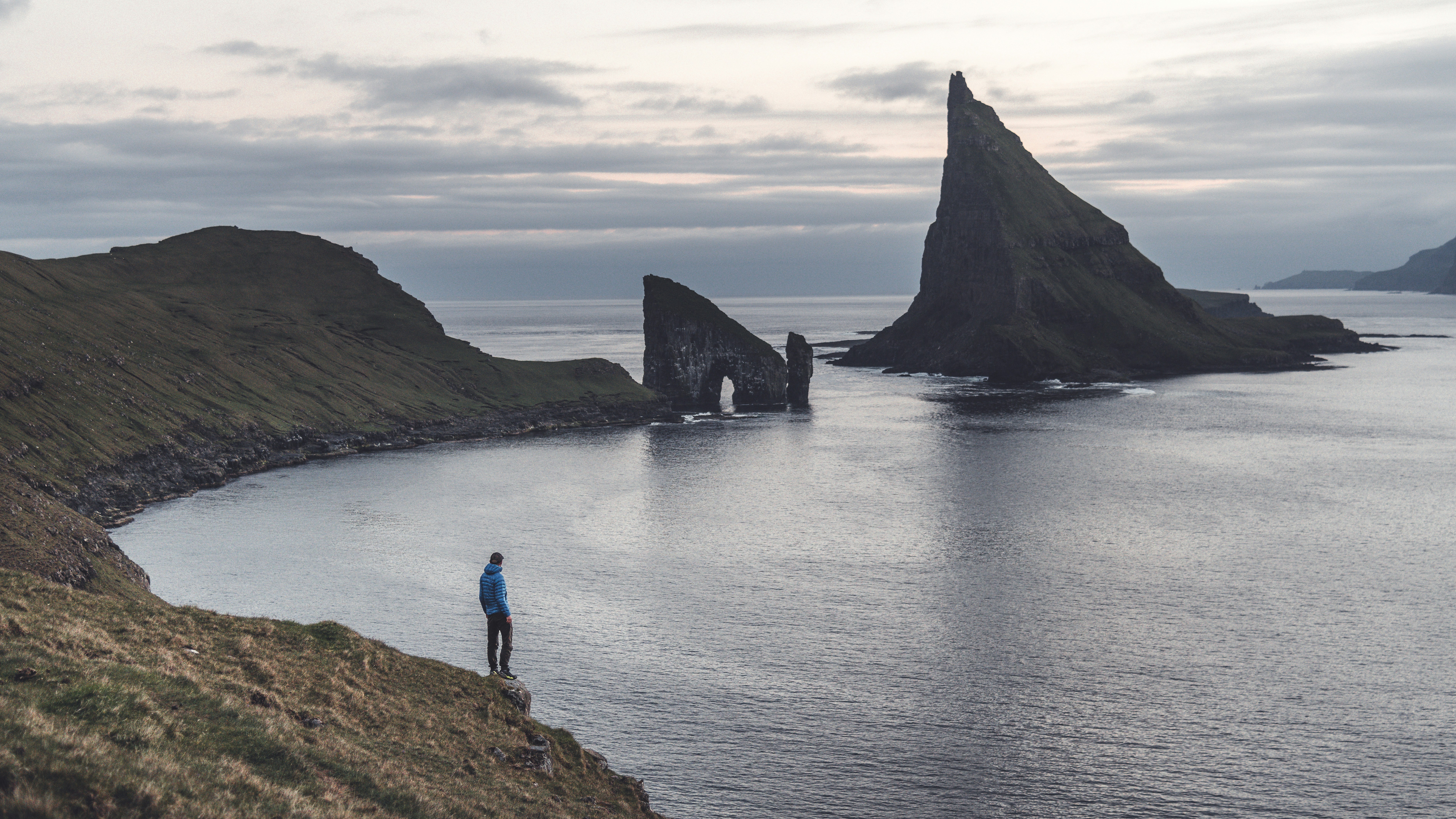 Lone Explorer Beneath the Spire: A Coastal Chase