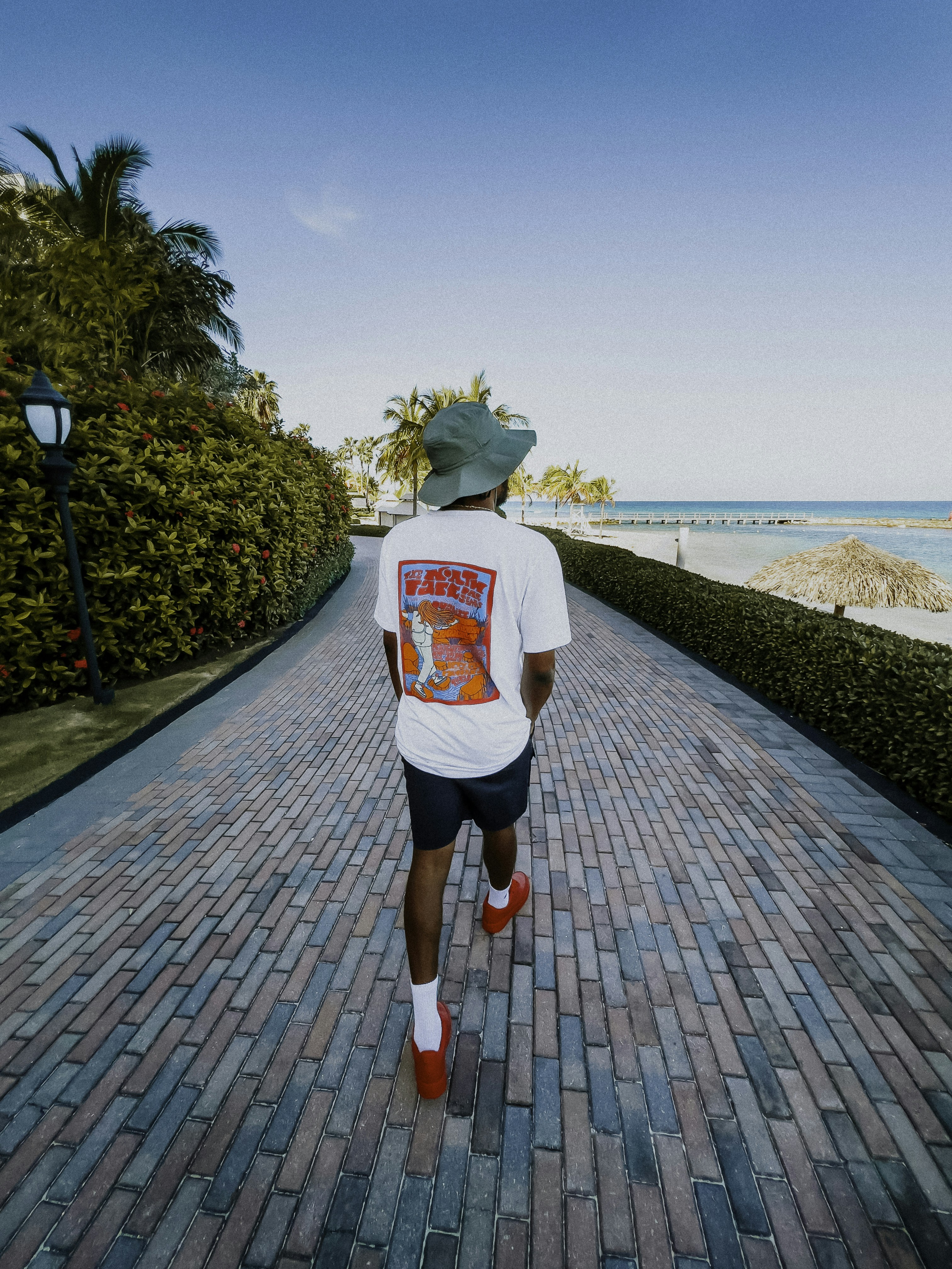 a man is running down a brick path
