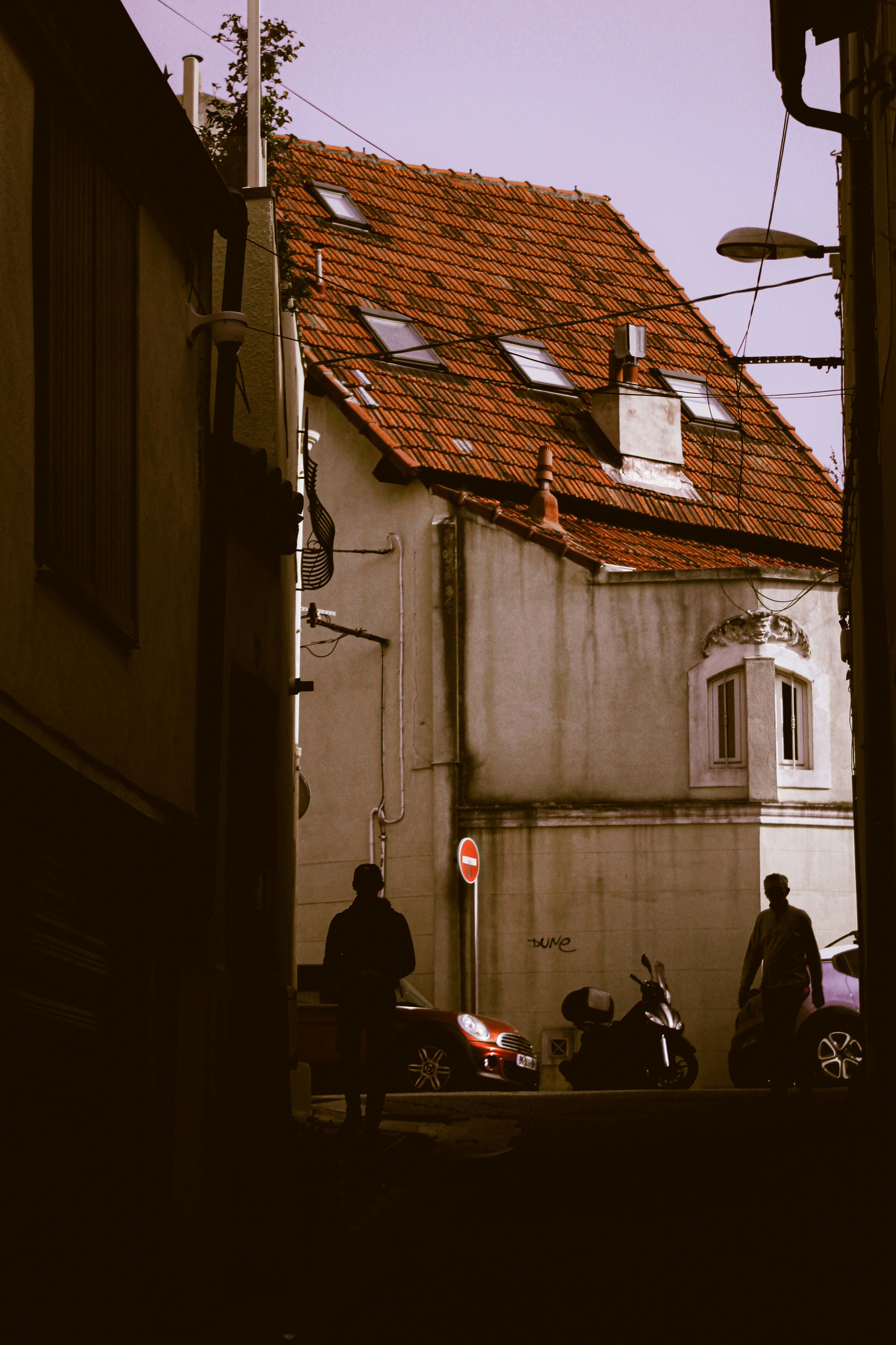 Sepia Backstreet: Silhouettes, Rooftops, and a Quiet No-Entry