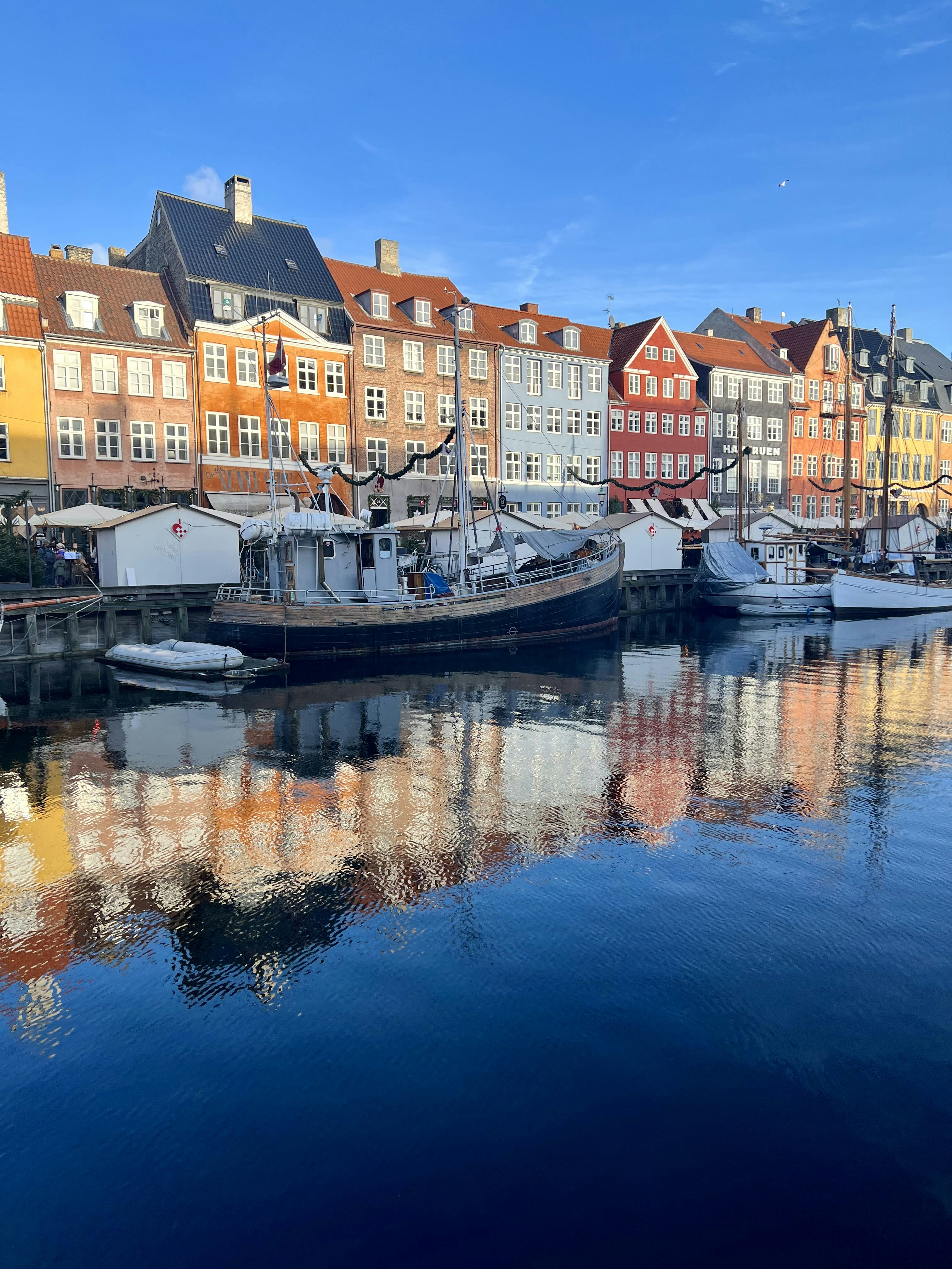 Pastel Harbor Row: Boats, Reflections, and a Copenhagen Waterfront