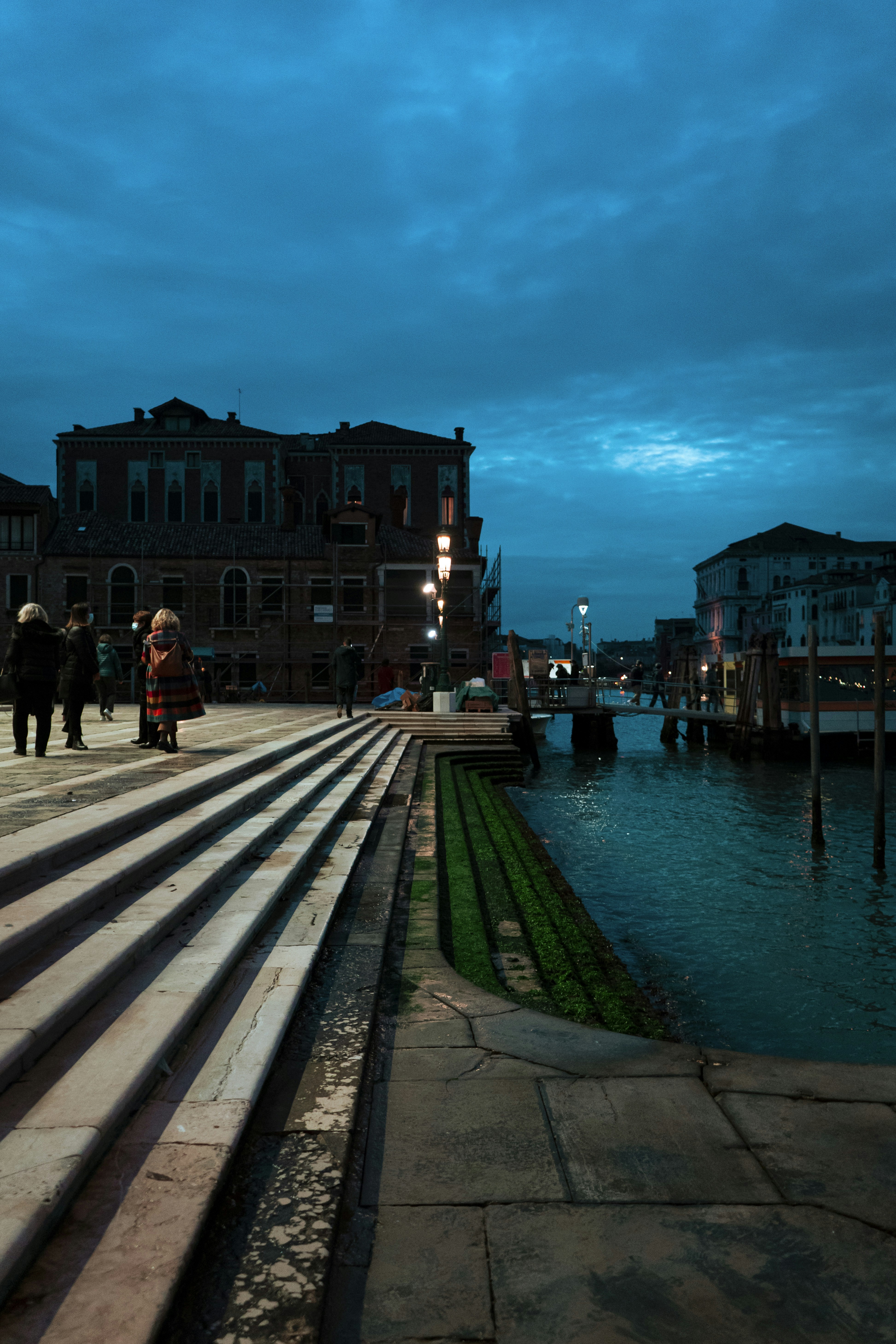 Blue Hour by the Canal: Steps, Water, and Quiet Figures