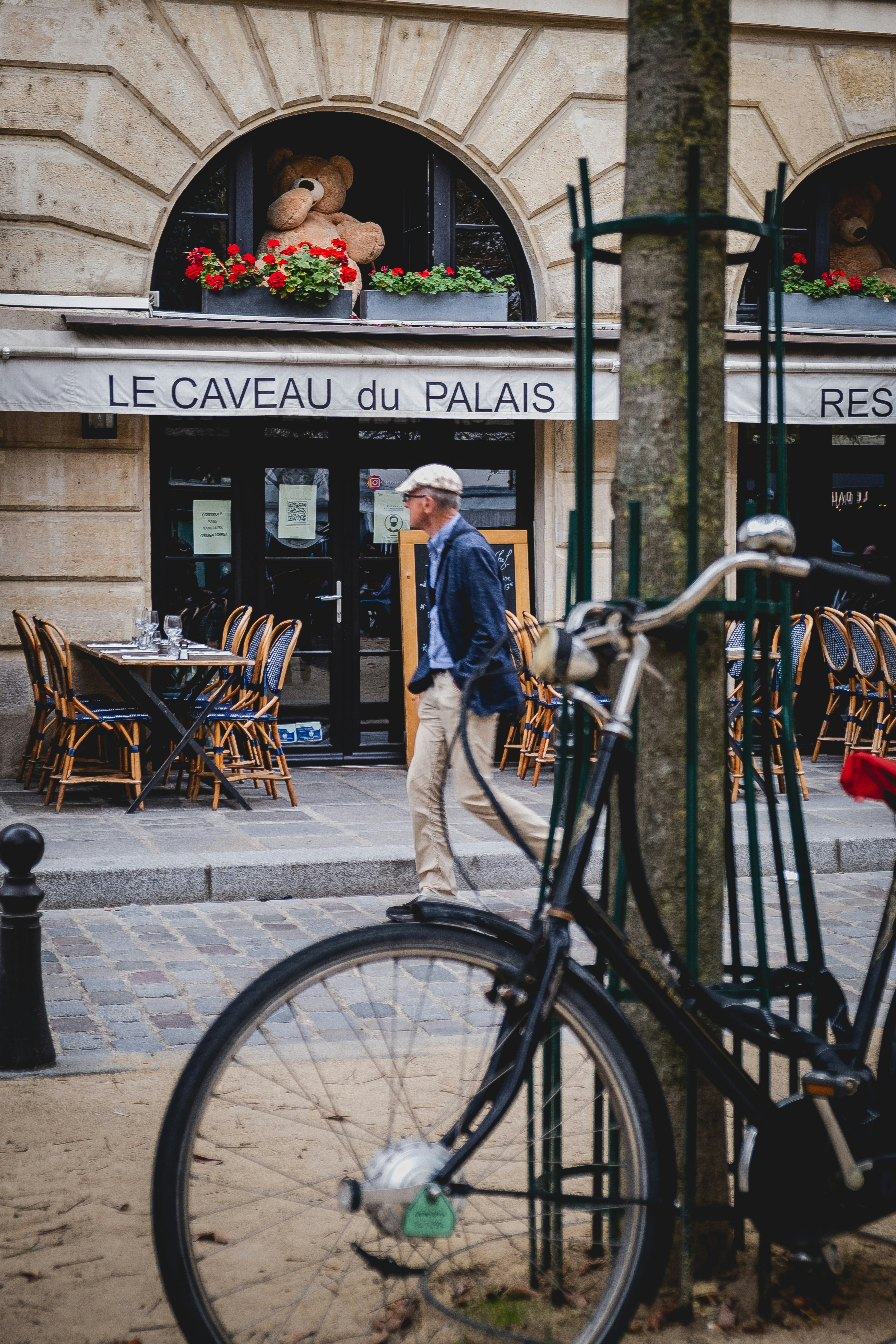 Across the Café Terrace: A Quiet Stroll by Le Caveau du Palais