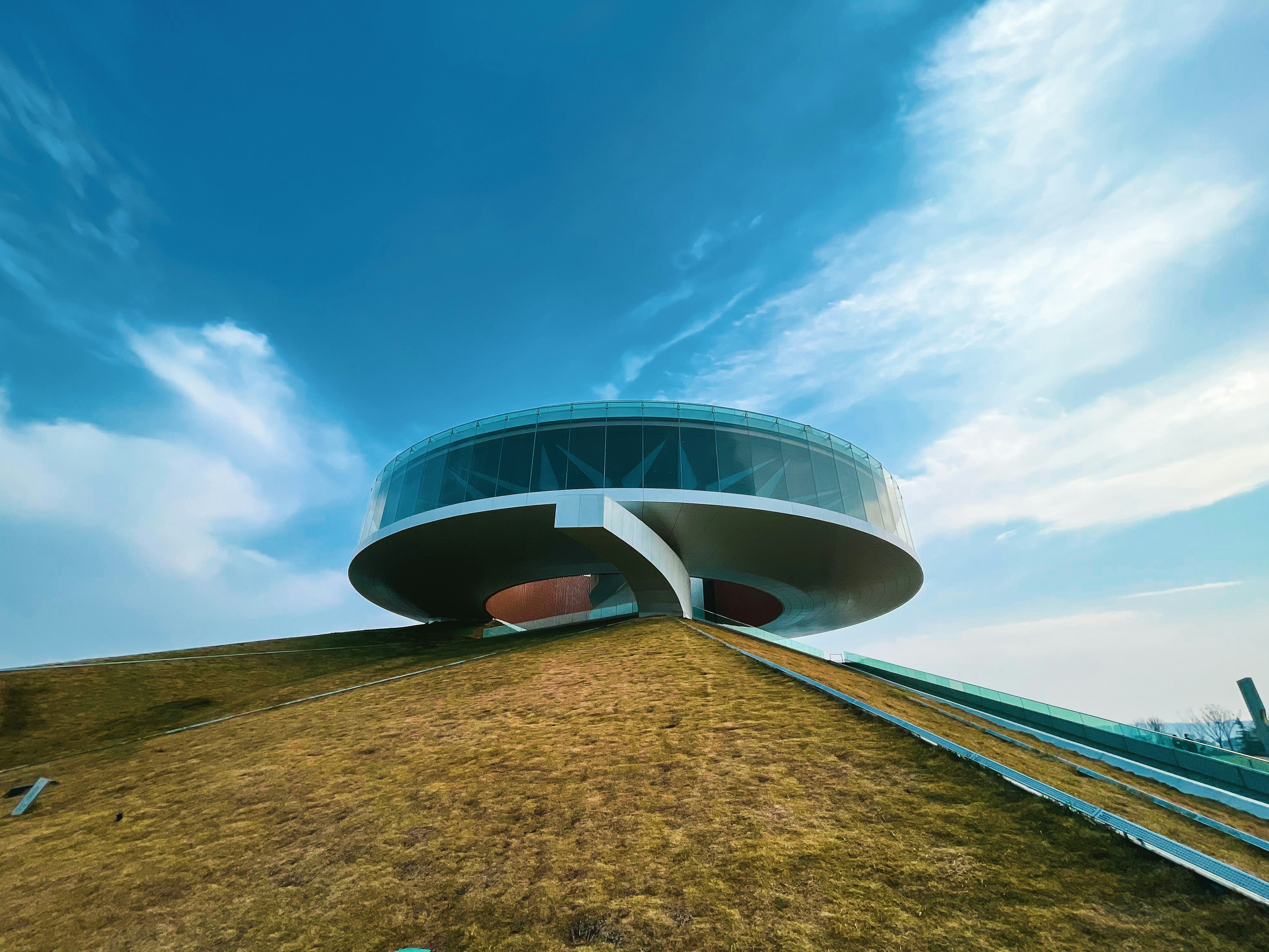 A building on top of a hill with a sky background photo – Free Outdoors ...