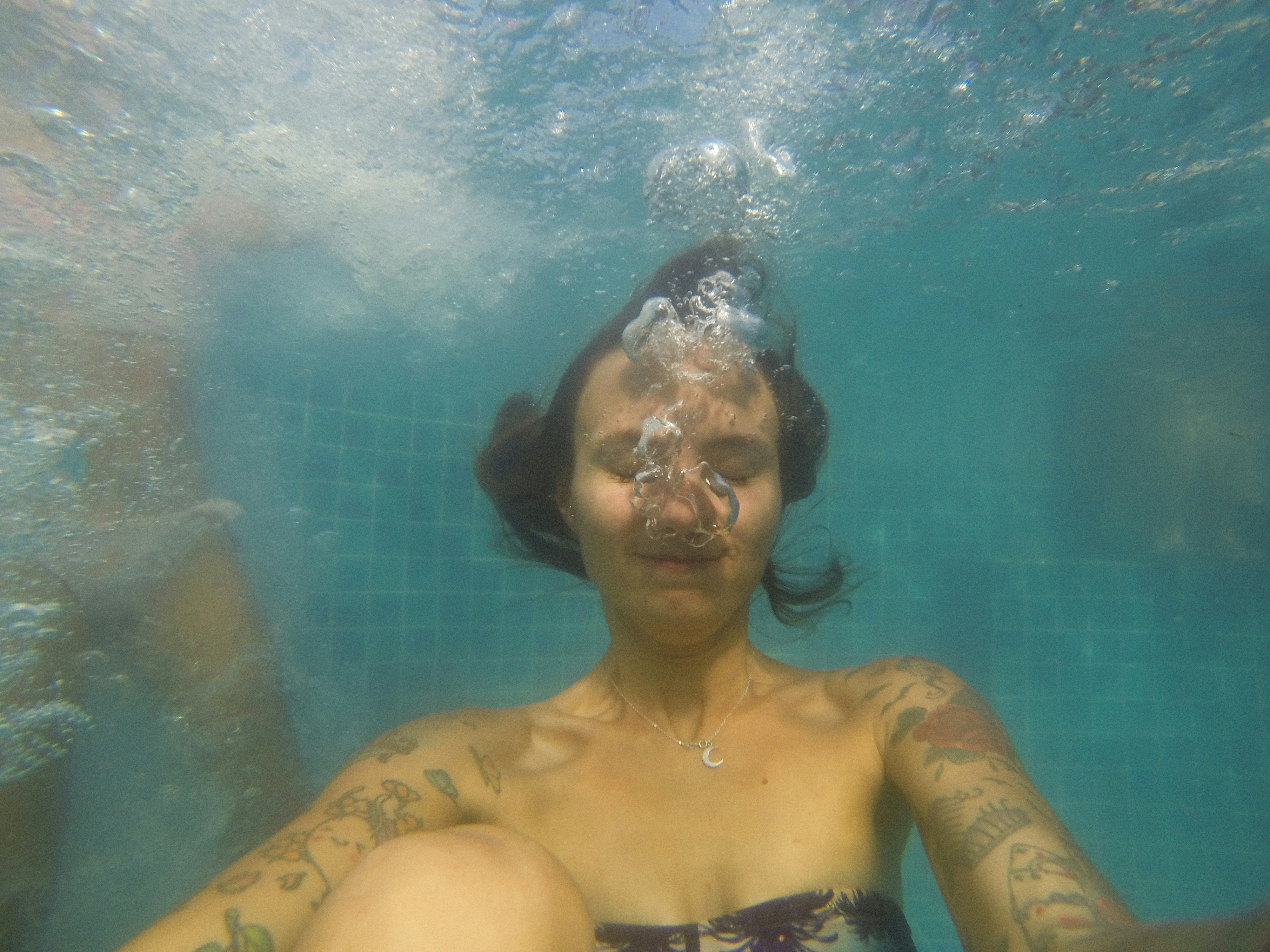a woman in a bikini under the water