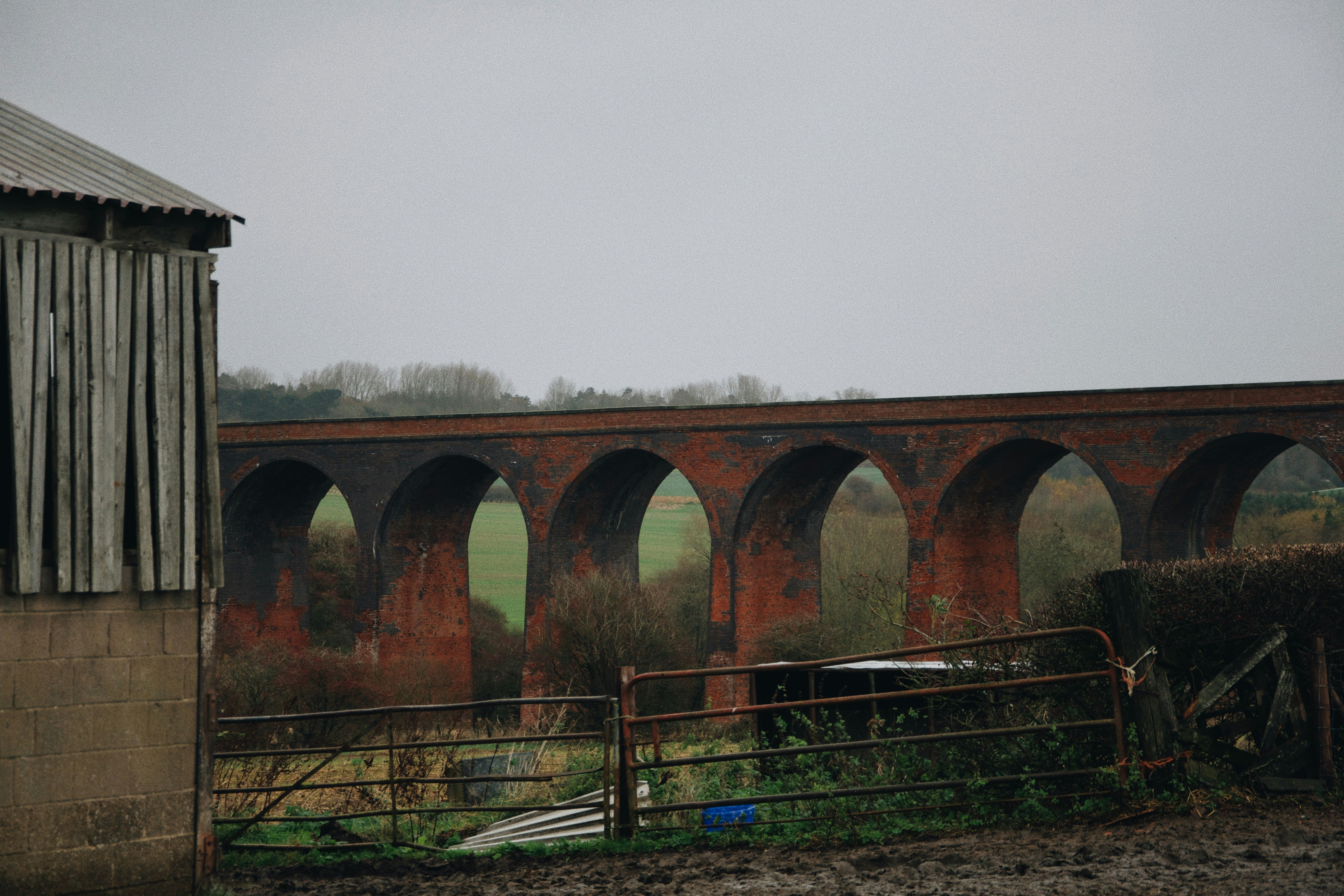 Brick Arches Across a Quiet Farmyard