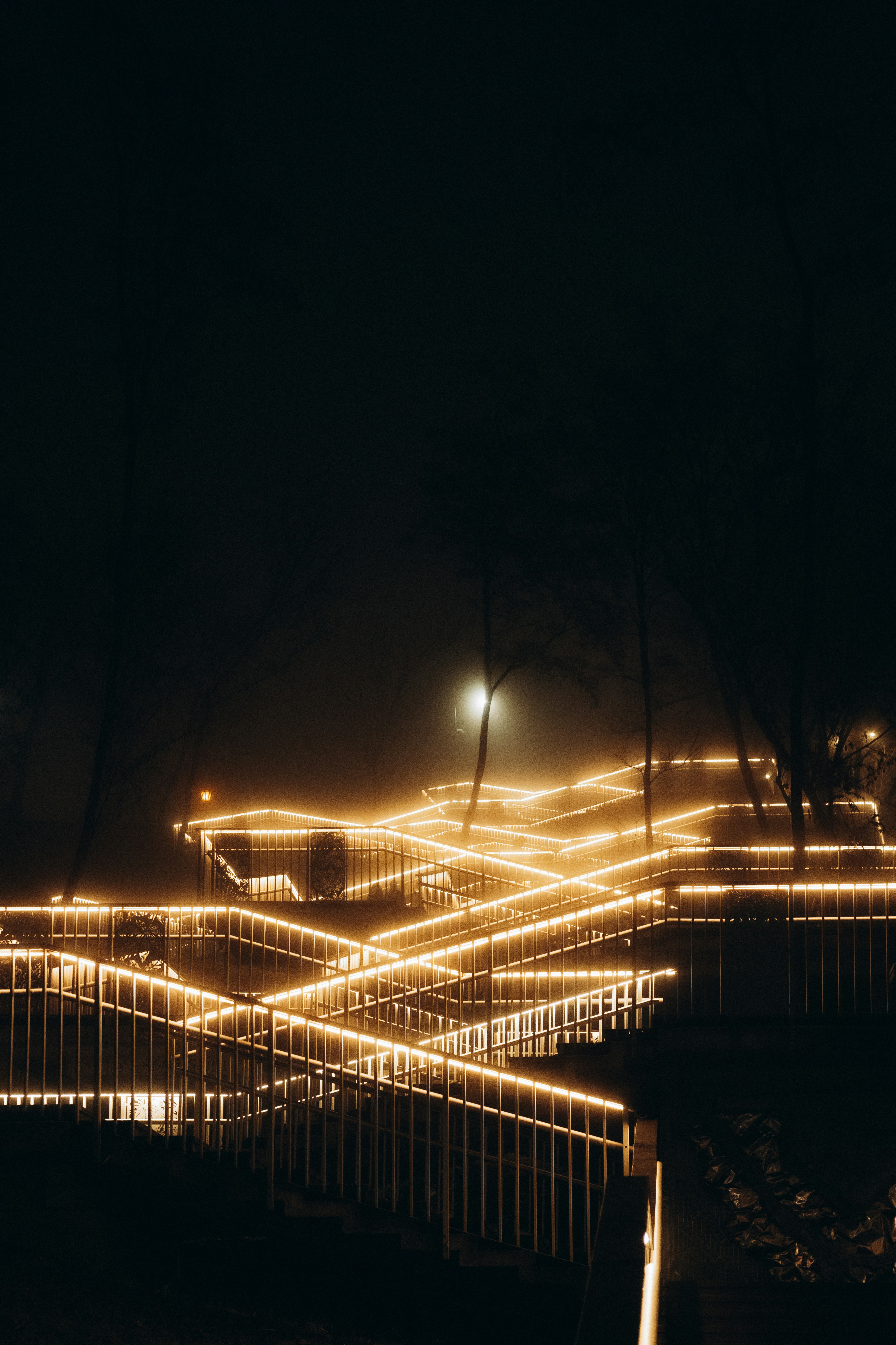 A night scene with lights on a bridge photo – Free Light Image on Unsplash
