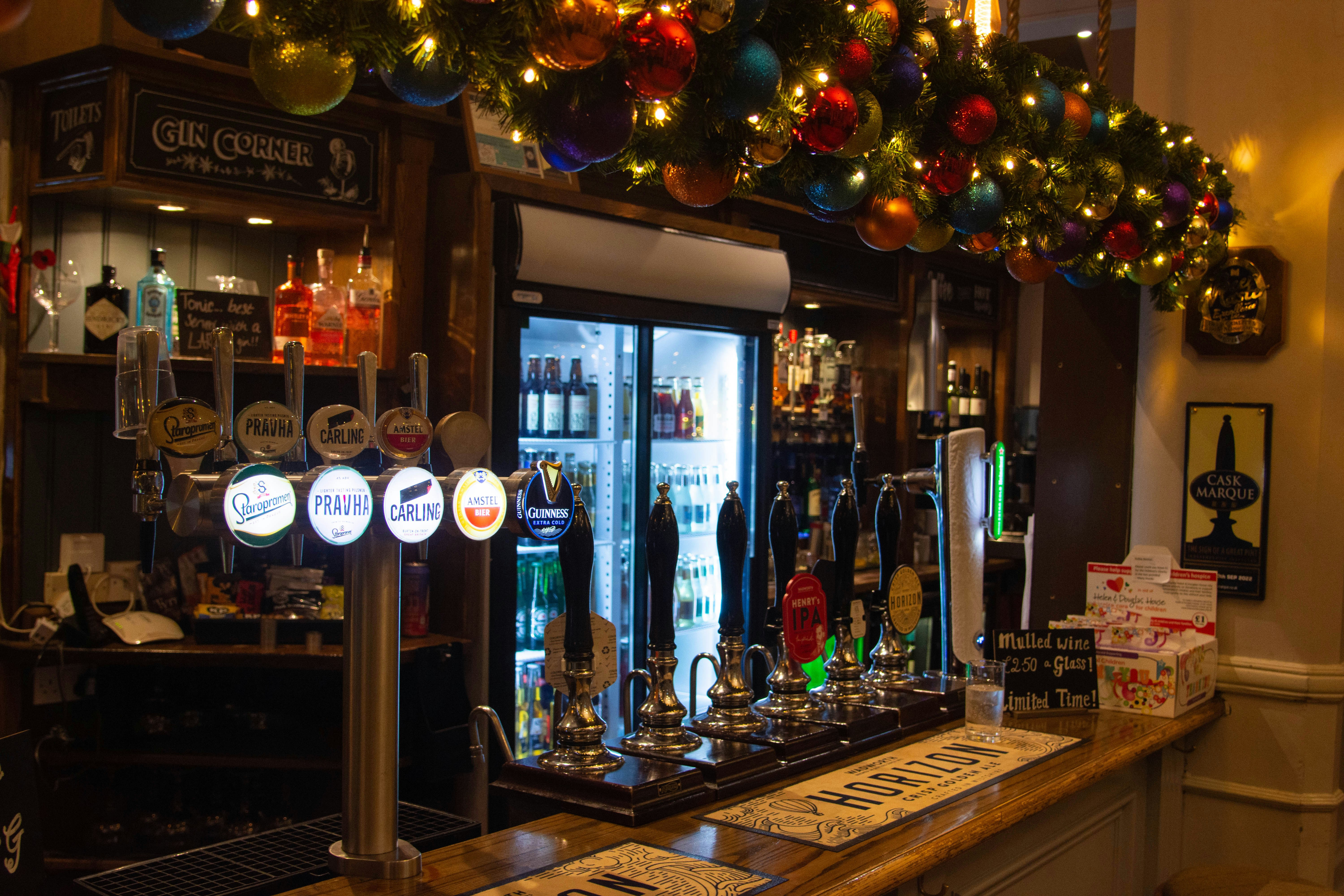 A bar with a bunch of different types of beer photo – Free Pub Image on ...