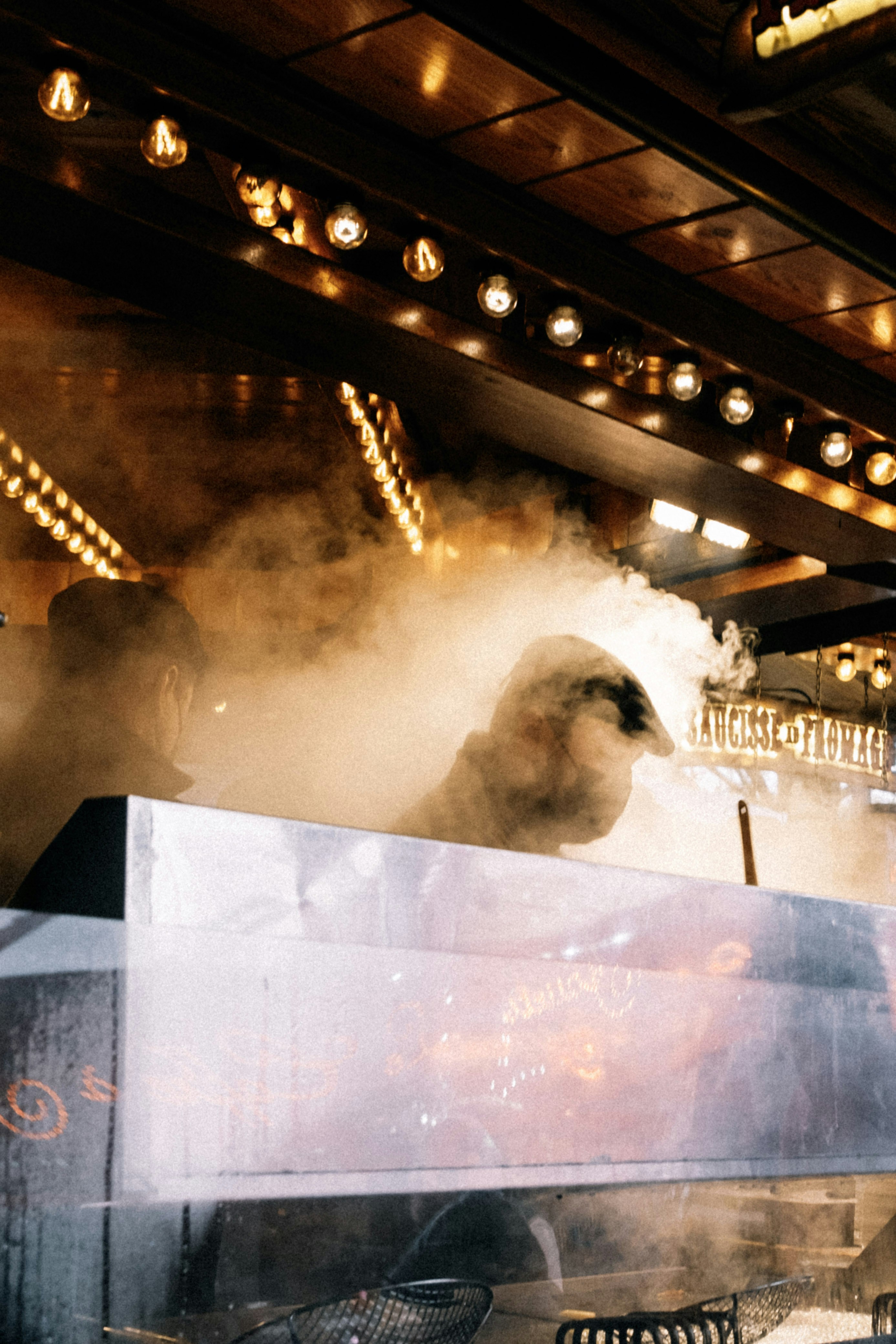 Steam and Spotlight at the Night Market Stall