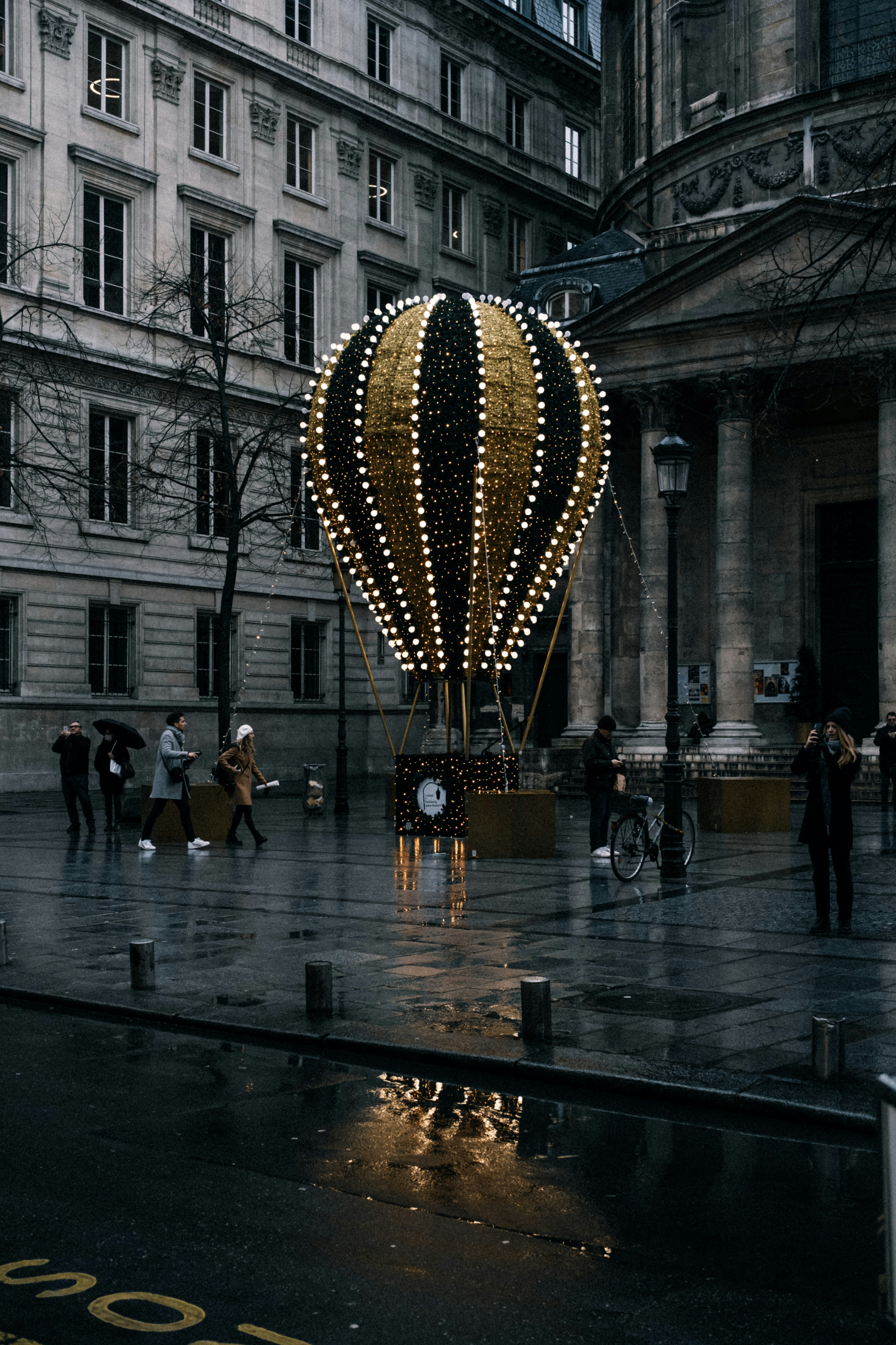 Glow-Balloon Over Wet Cobblestones