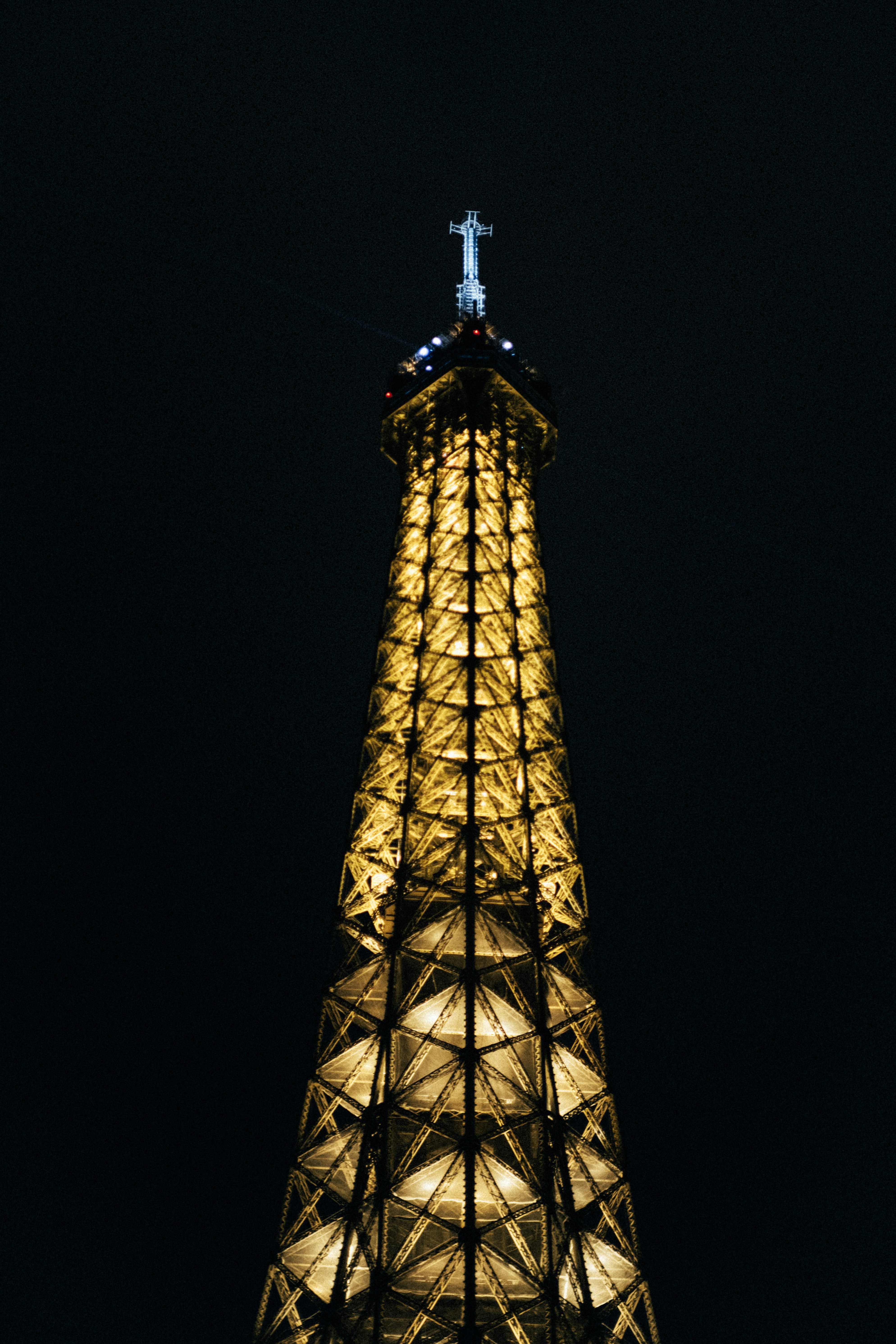 Nocturnal Lattice: The Golden Spine Reaching the Night Sky