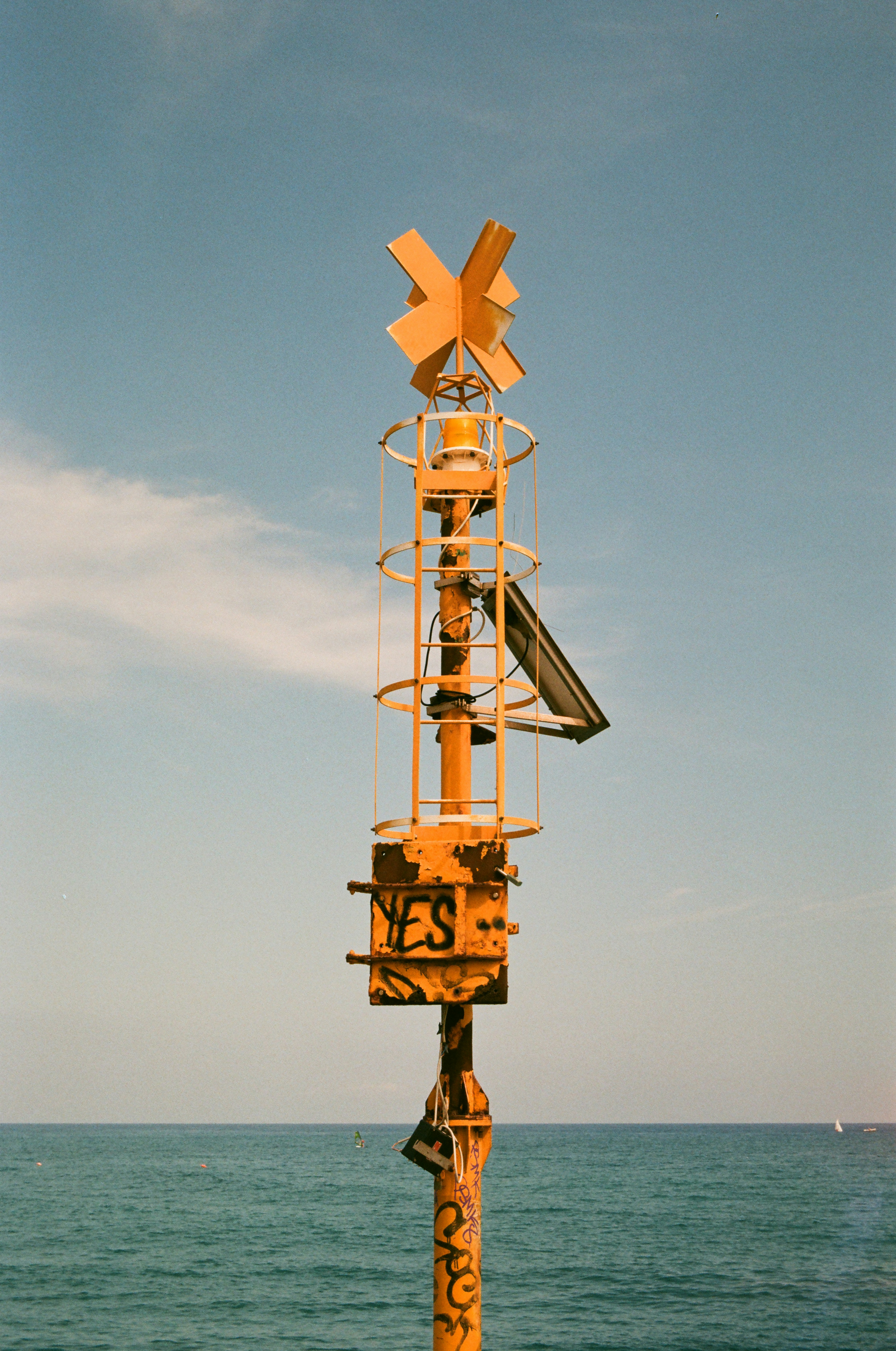 A yellow pole with a sign on top of it photo – Free Italy Image on Unsplash