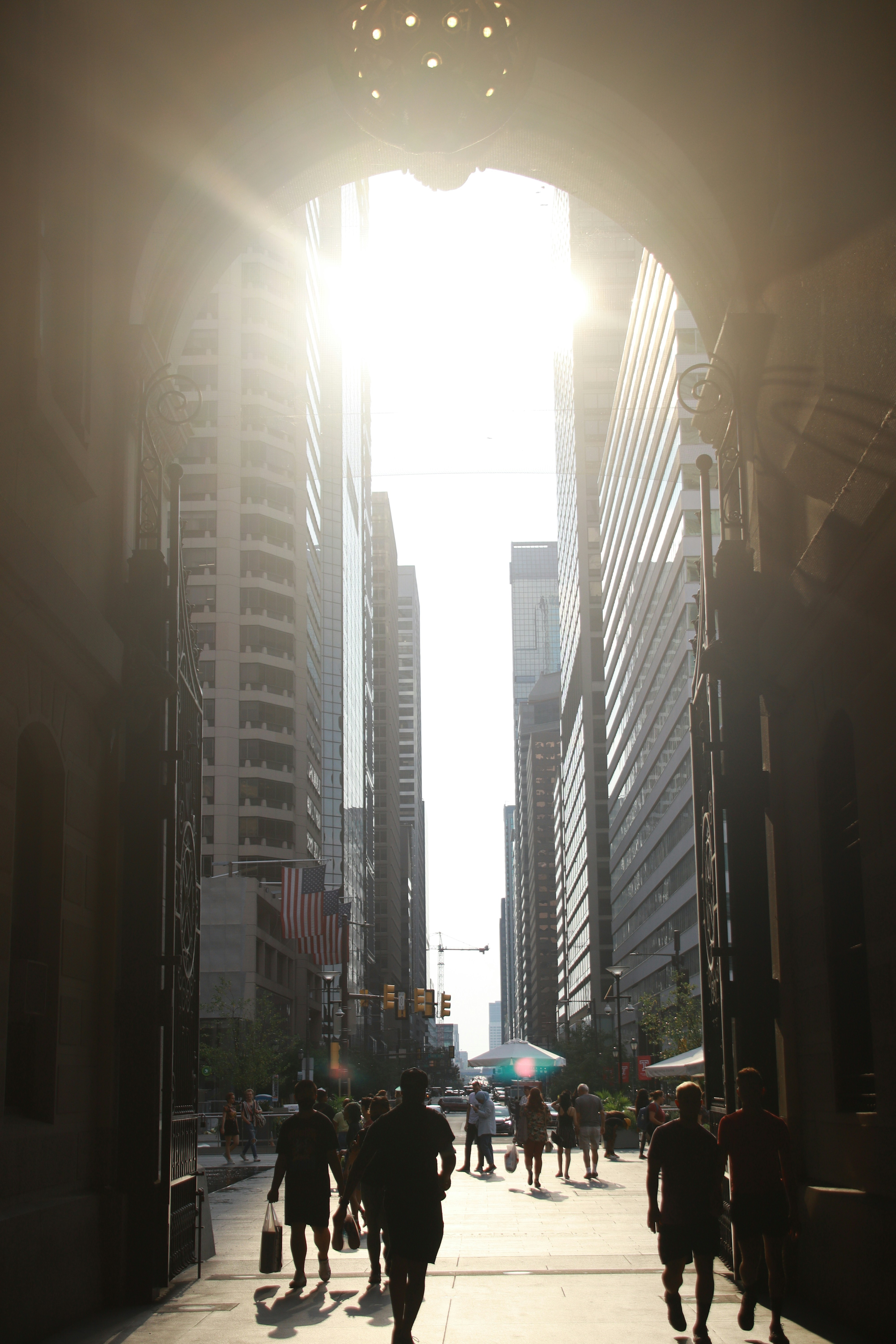 Archway to the City: Sunlit Corridor Between Skyscrapers