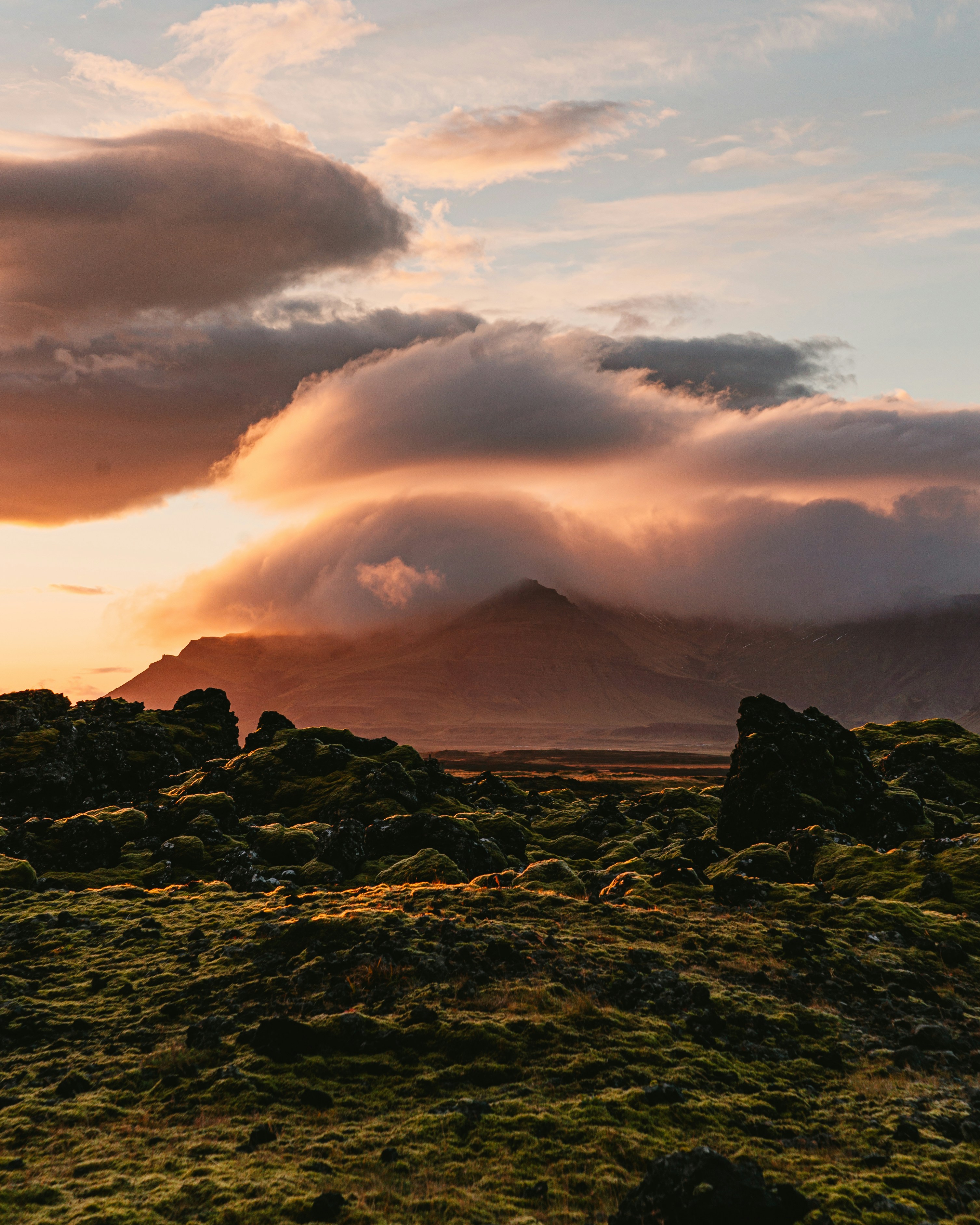 Cloud Crown Over a Mossy Lava Plain at Sunset