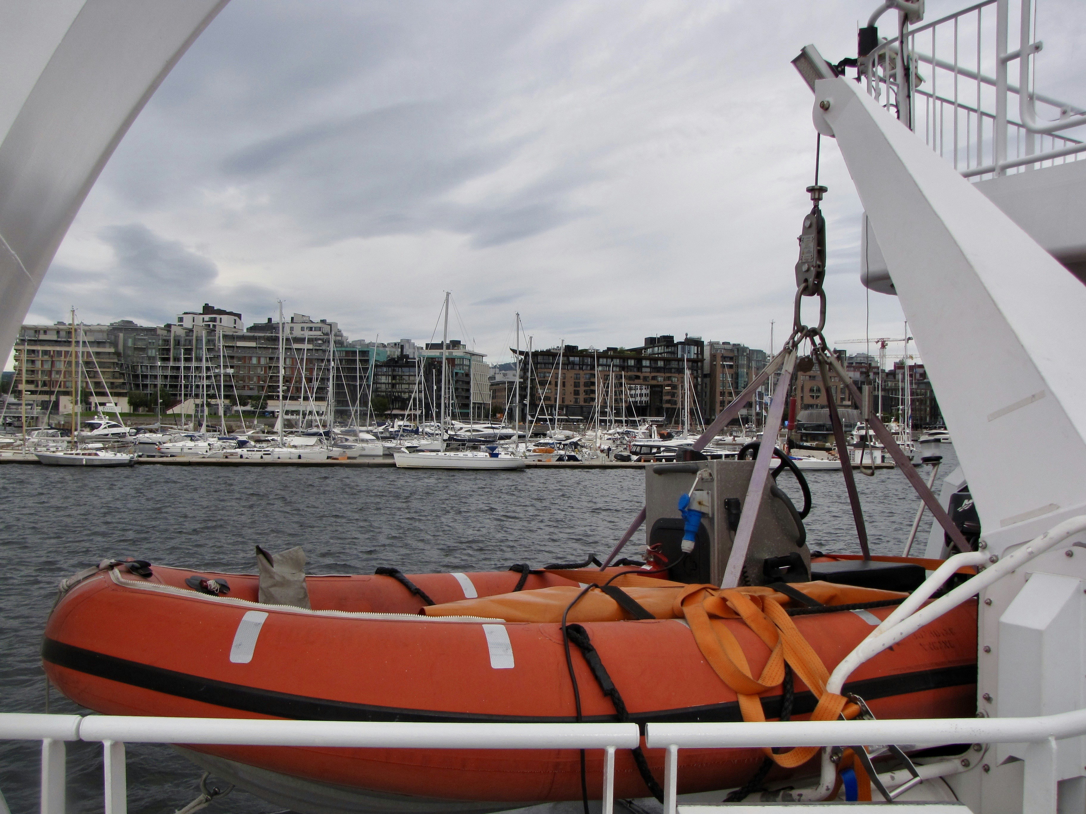 Harbor Lifeline: Orange Rescue Boat Anchored at the Marina
