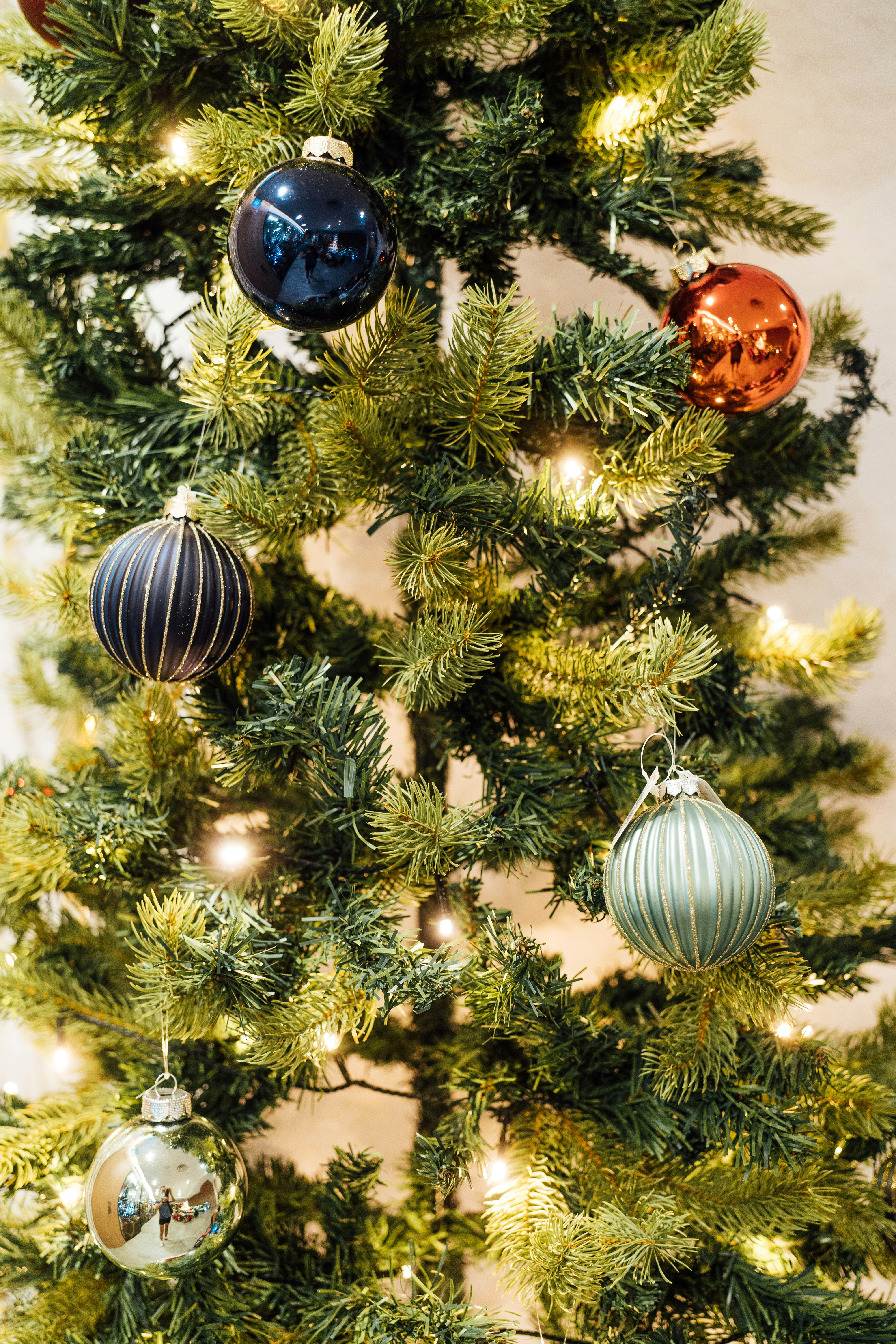 a christmas tree with ornaments hanging from it