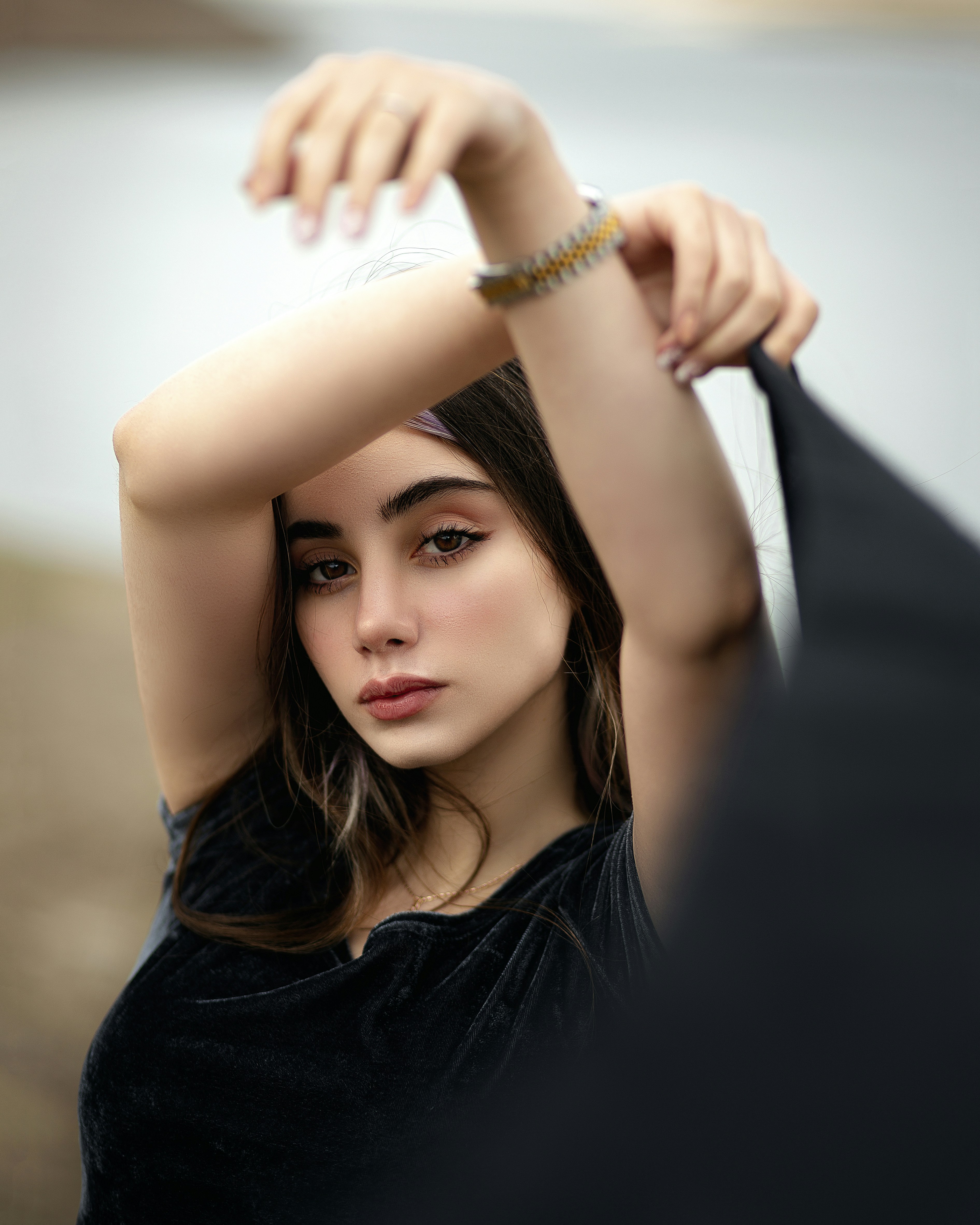 A woman with her arm around her head photo – Free Vouge Image on Unsplash