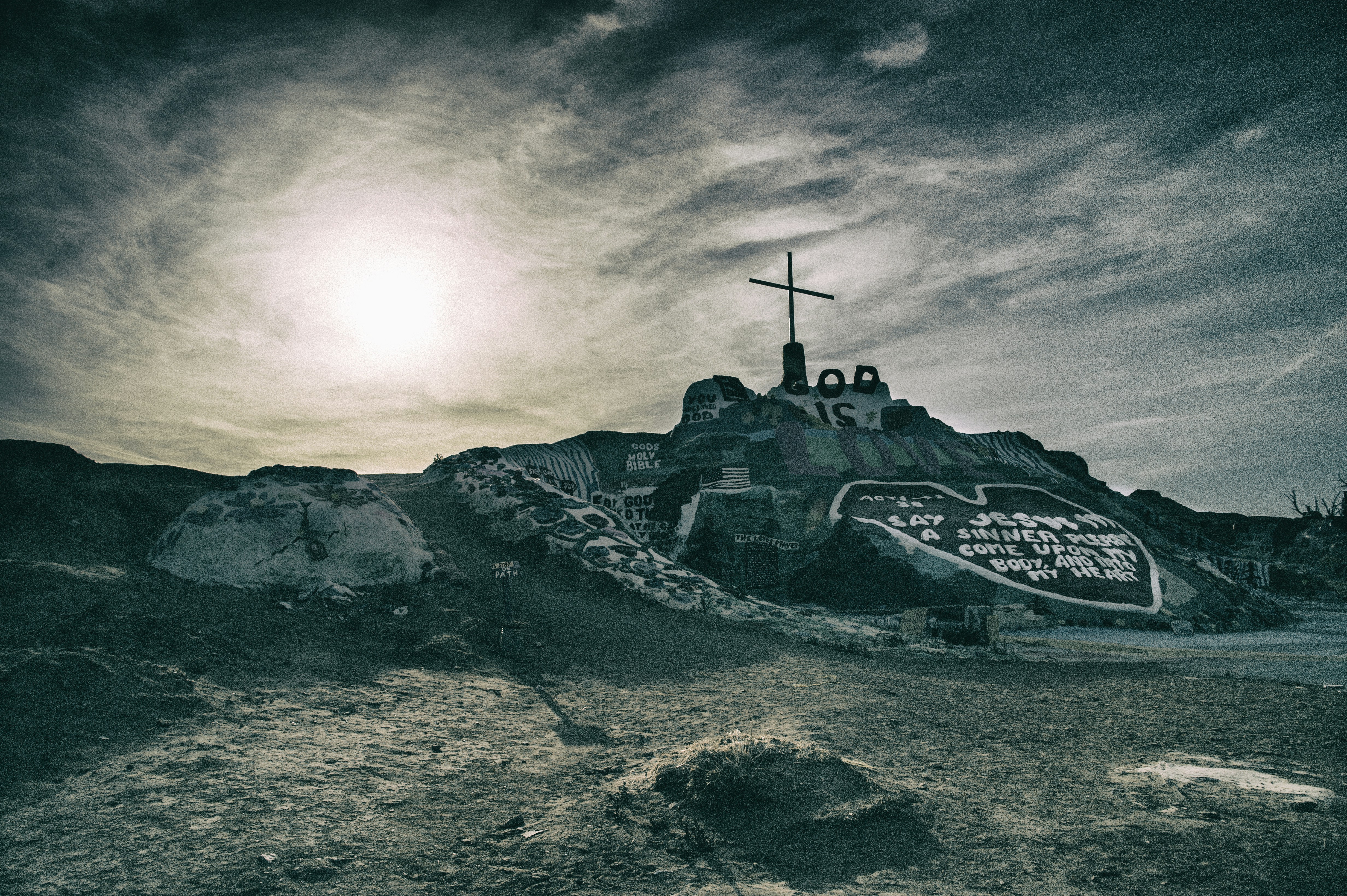Ruins of Silence: Cross and Skyscraper of Weathered Stone