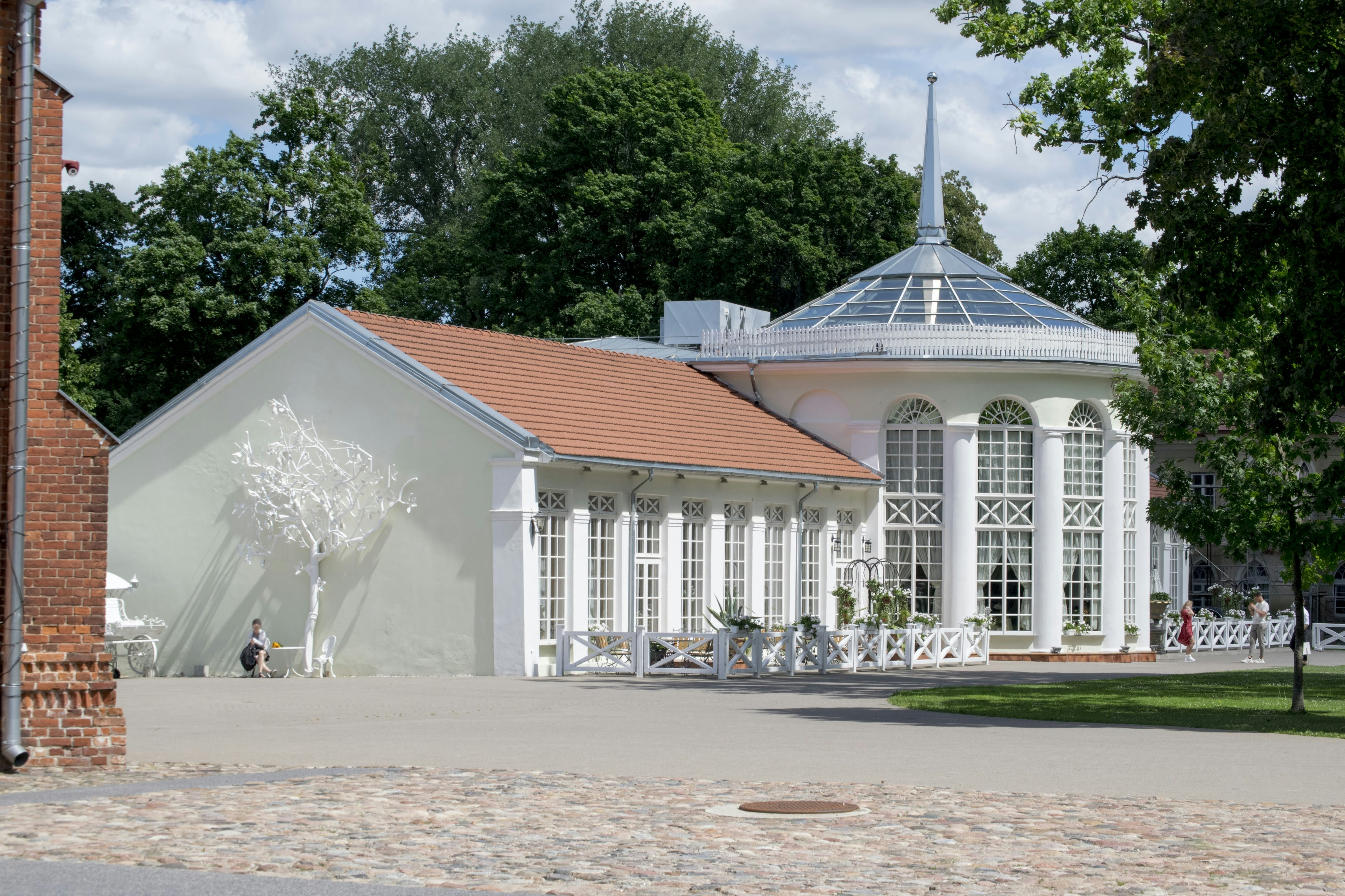 A white building with a red roof and white windows photo – Free ...