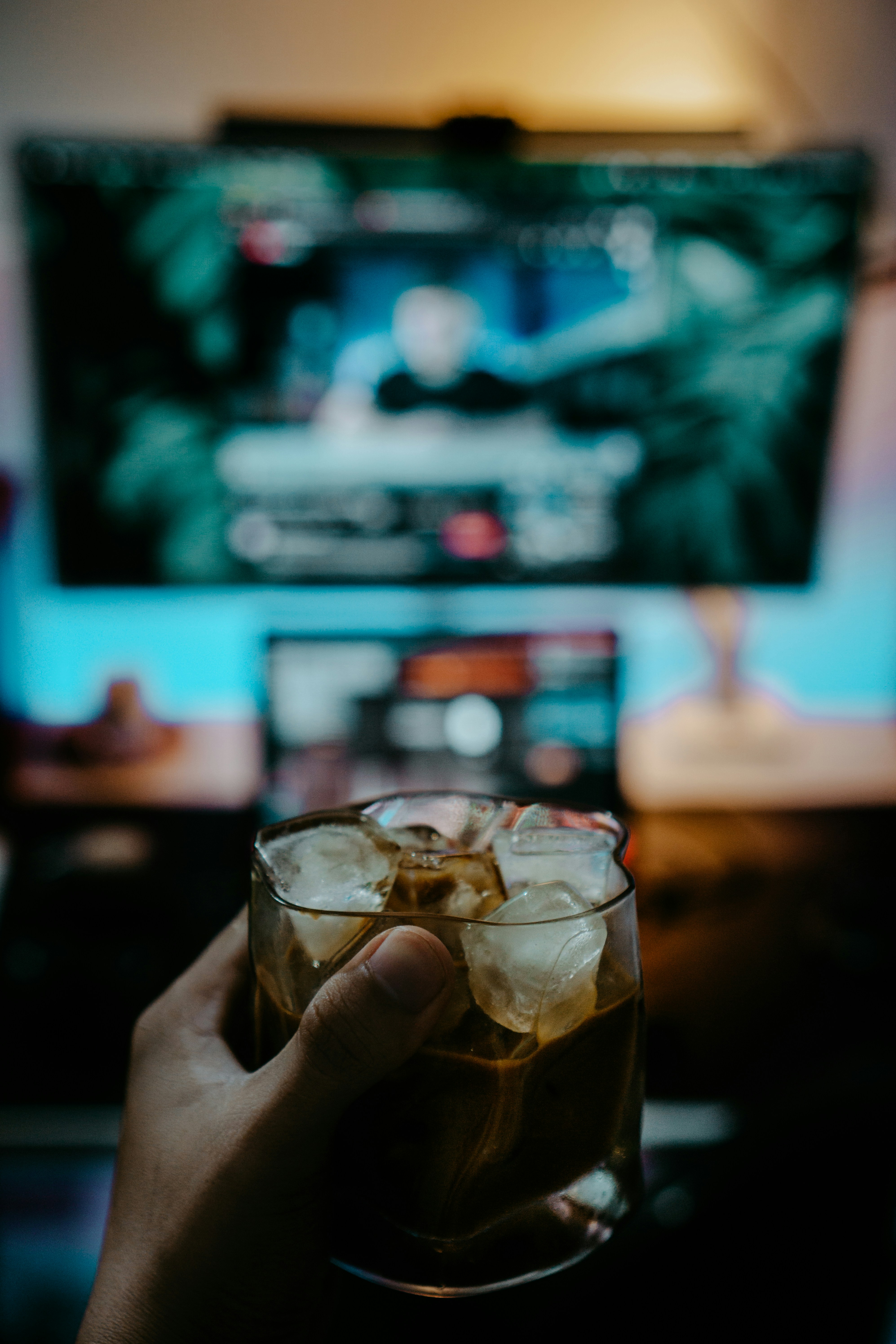 A Quiet Cheers: Frosty Ice in Focus, TV Glow in the Background