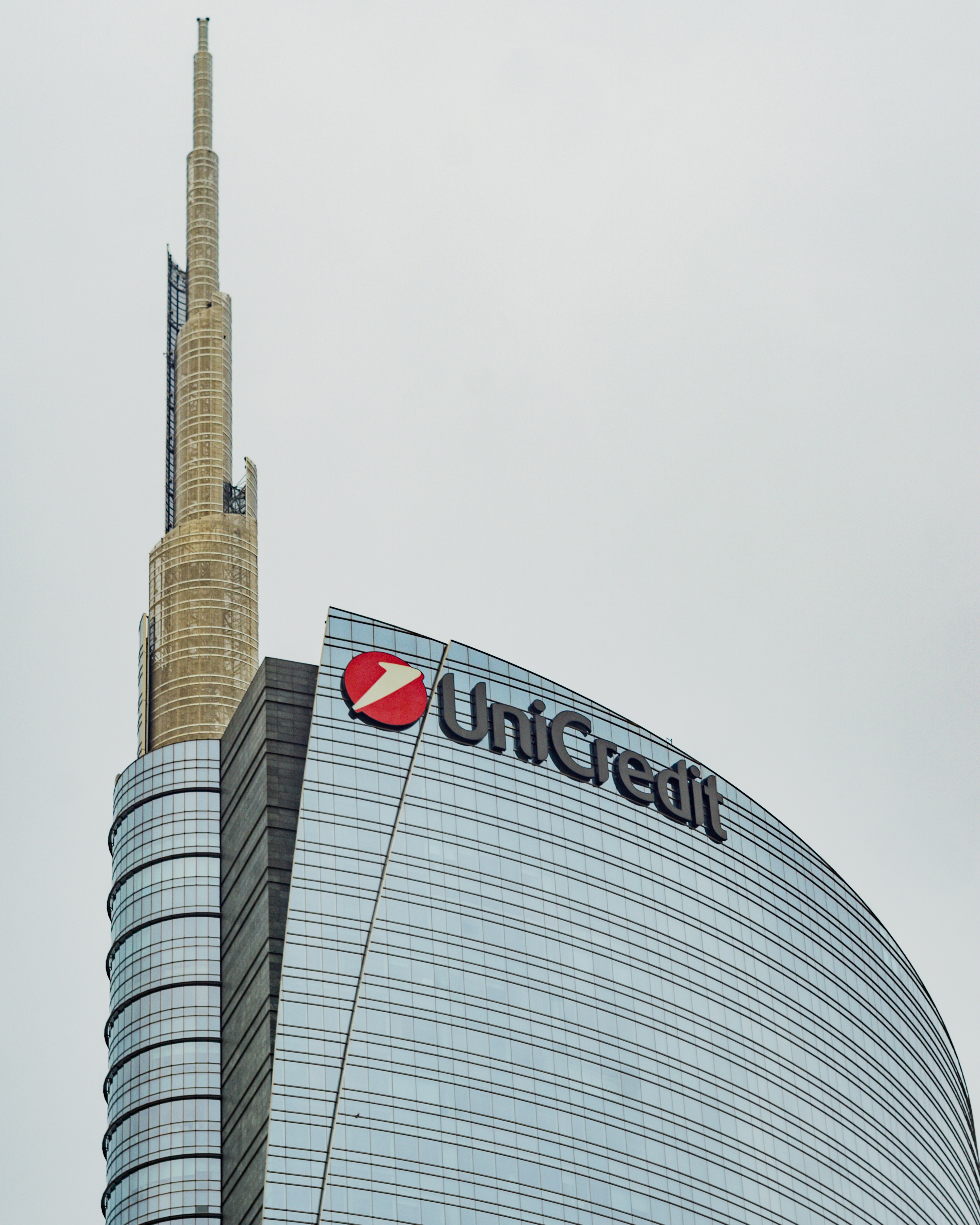 A tall building with a large sign on it's side photo – Free Milano ...