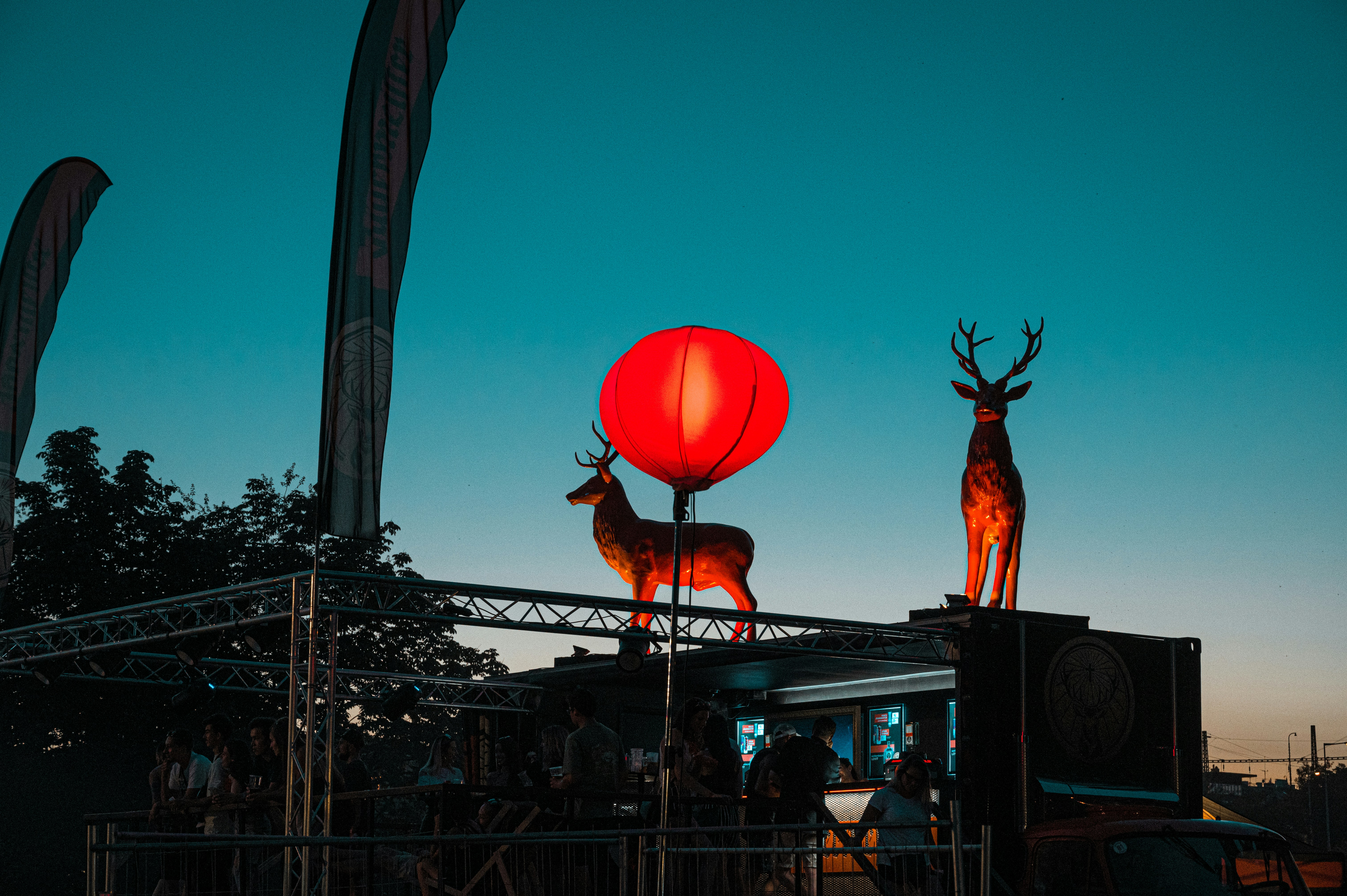 Red Lantern Crowned by Antlered Guardians at Dusk Festival