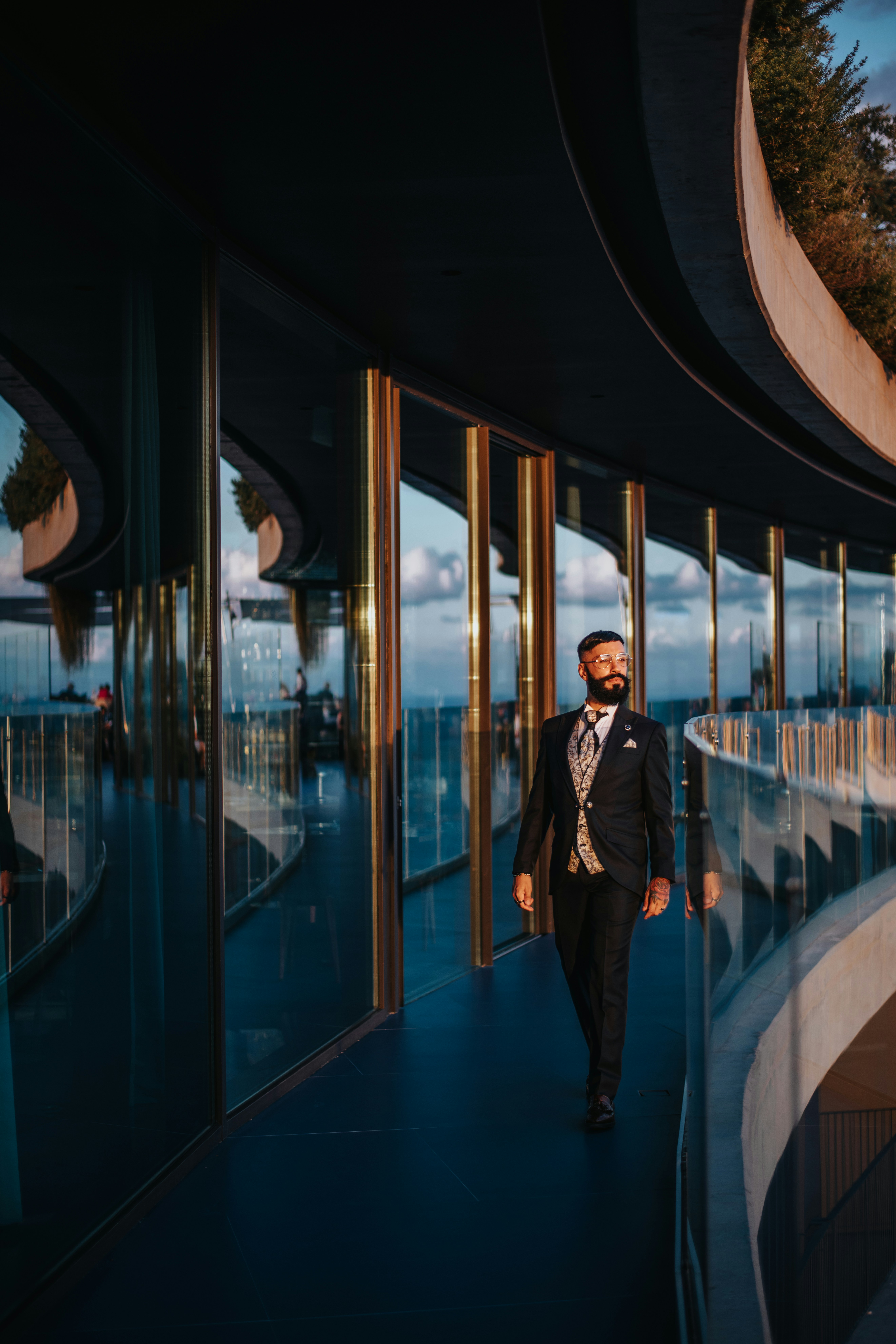 A man in a tuxedo walking down a walkway photo – Free Human Image on ...