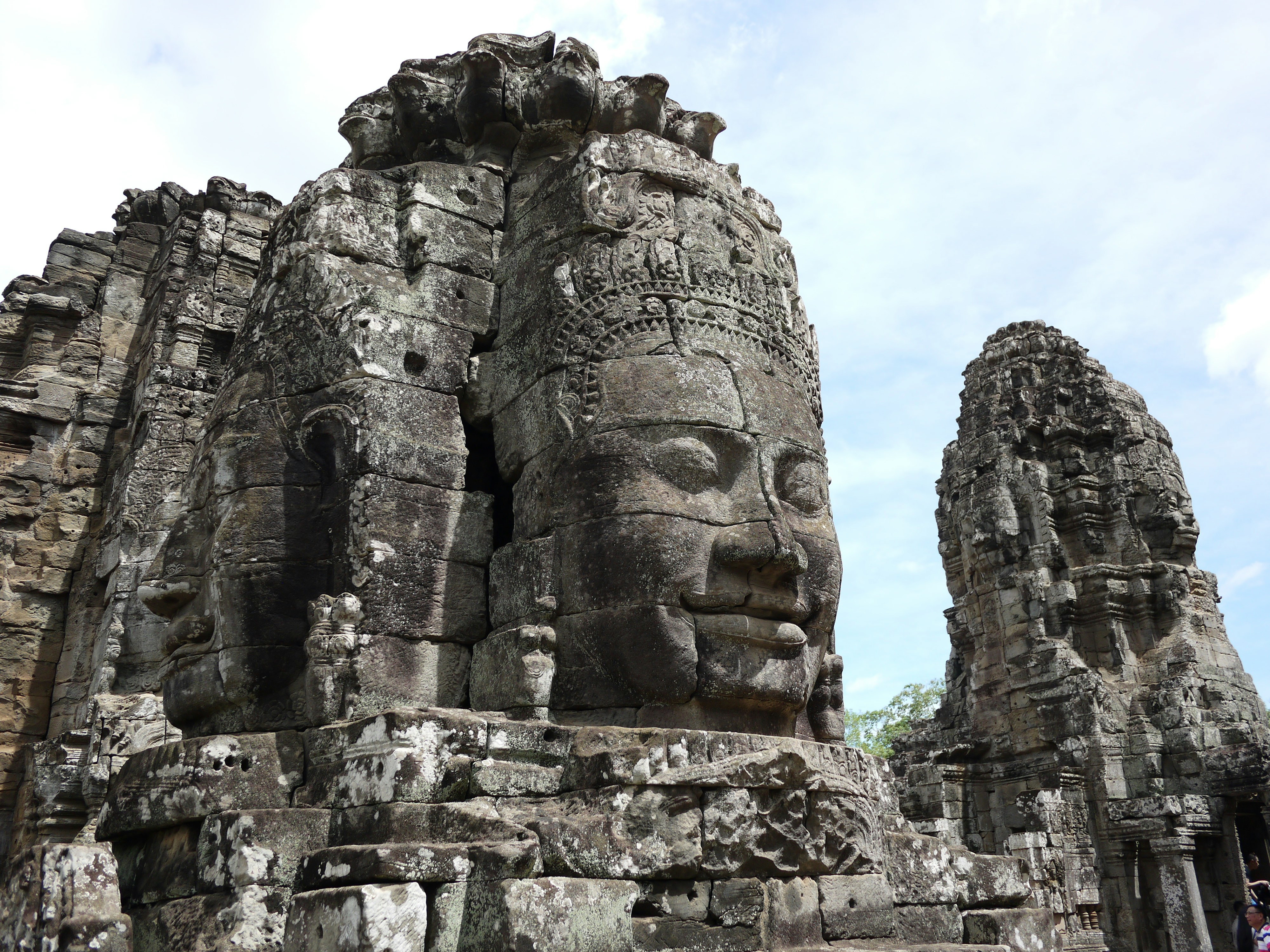 A large stone head in the middle of a building photo – Free Cambodia ...