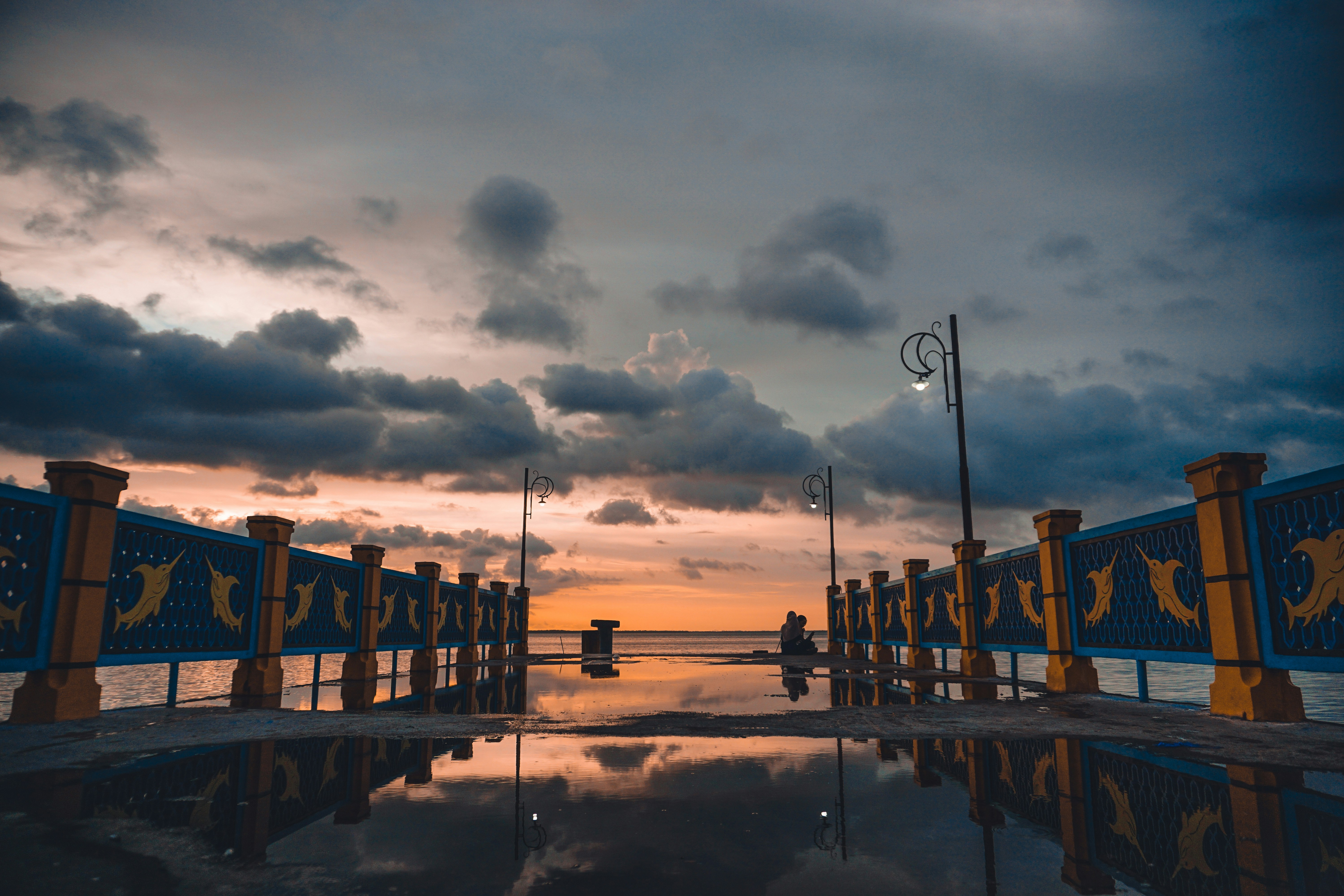 Horizon Echoes on the Blue Pier: Reflections at Sundown