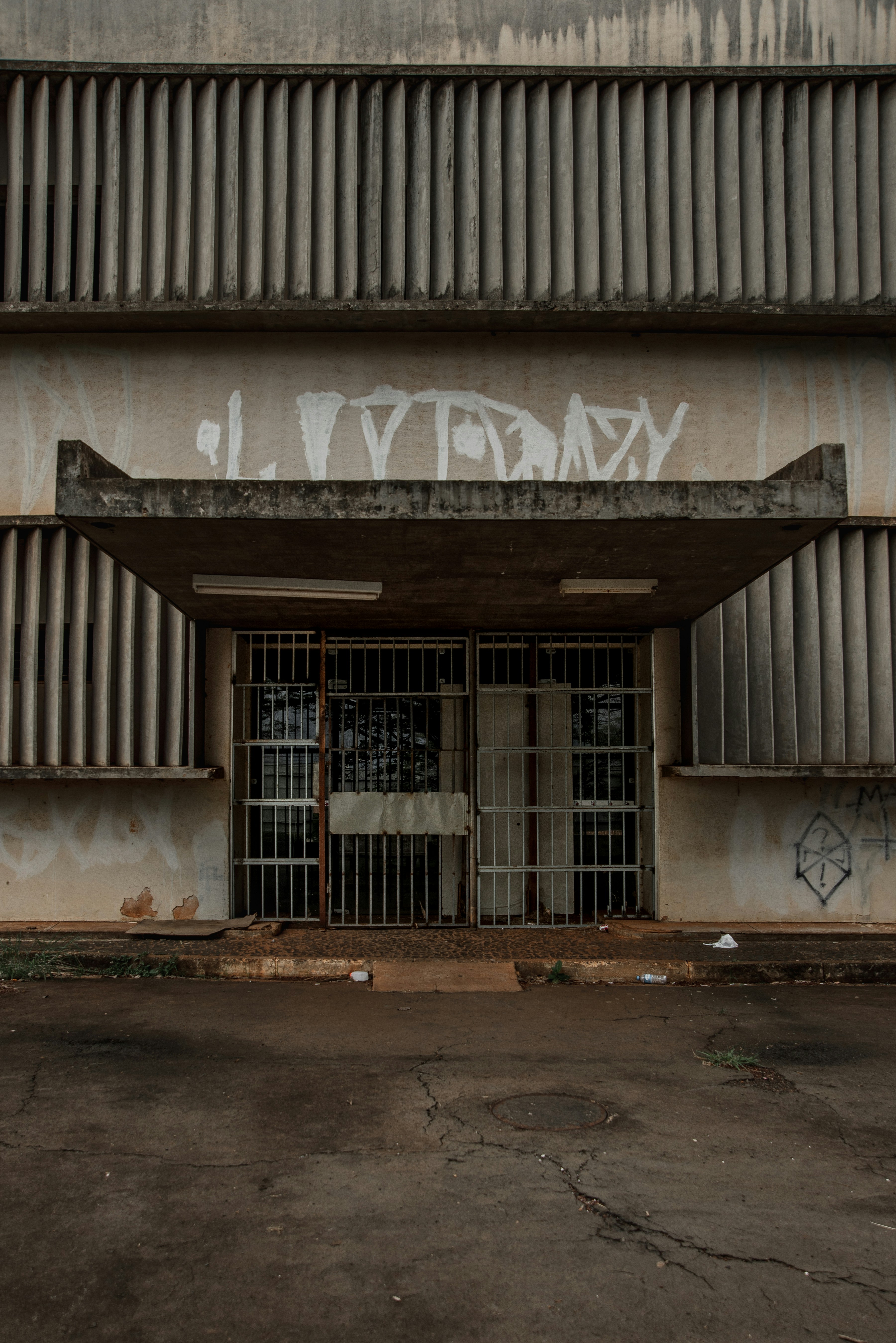 an old building with graffiti on the side of it