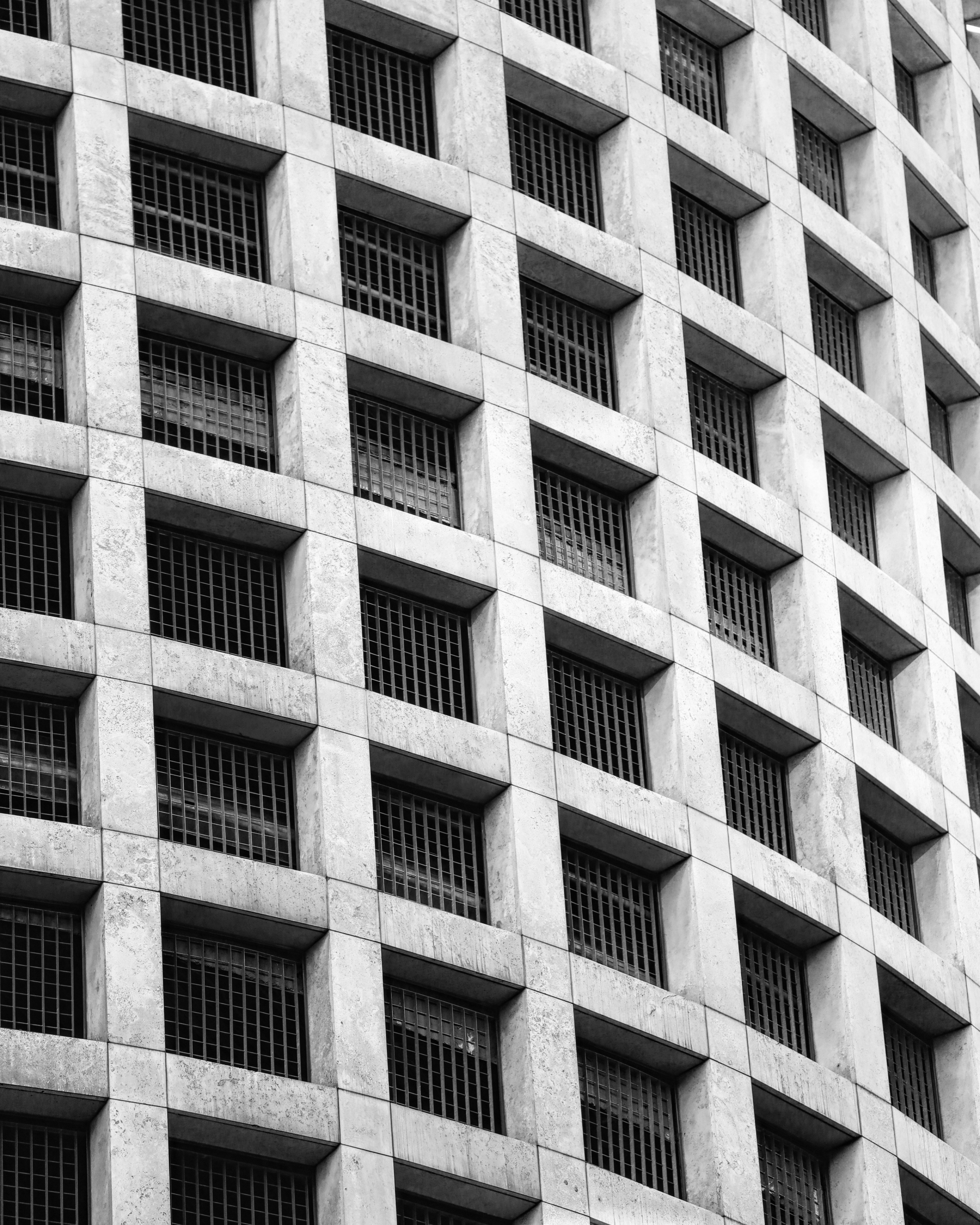 A building that has a bunch of windows on it photo – Free Texture Image ...