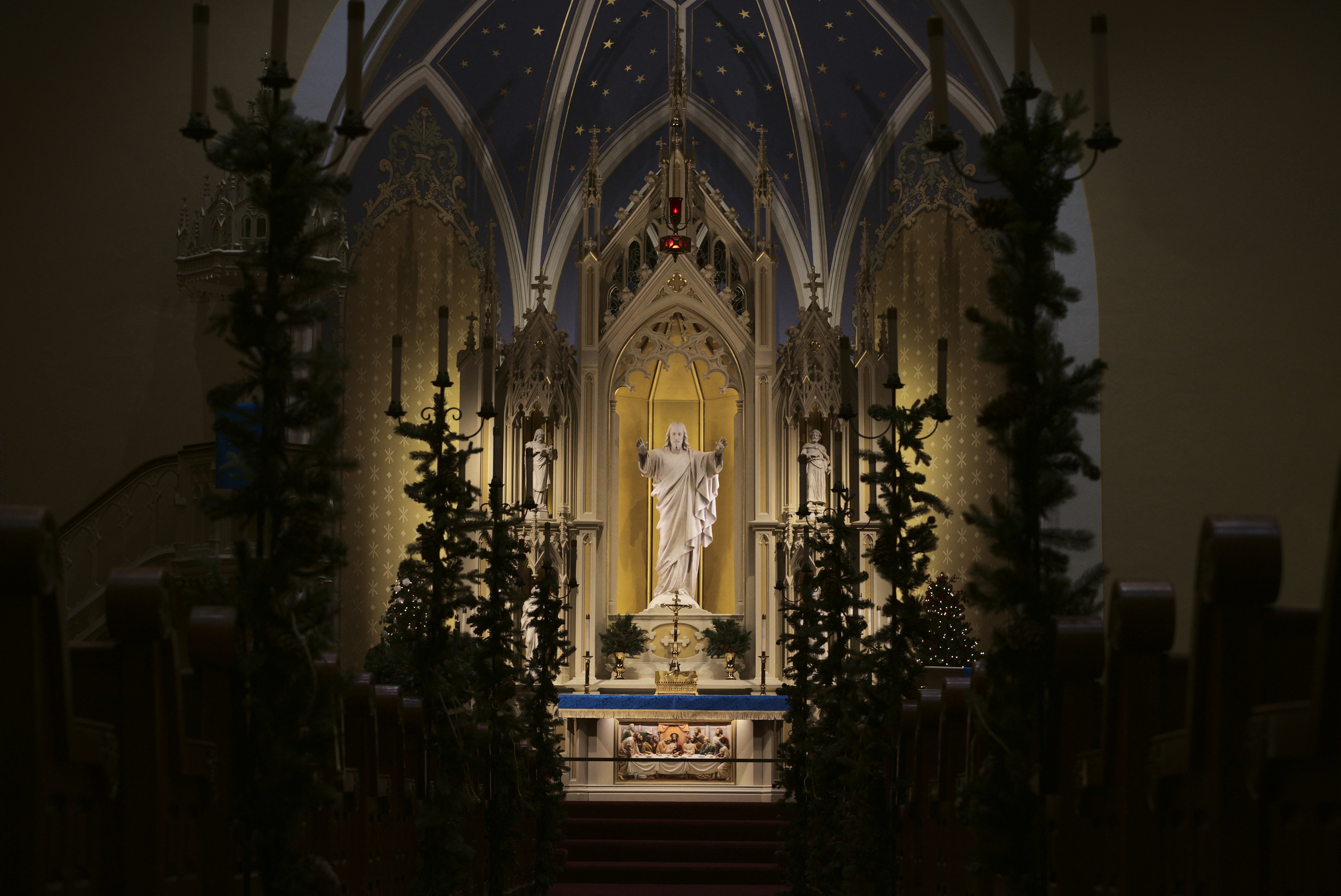 A church with a statue of jesus on the alter photo – Free Building ...