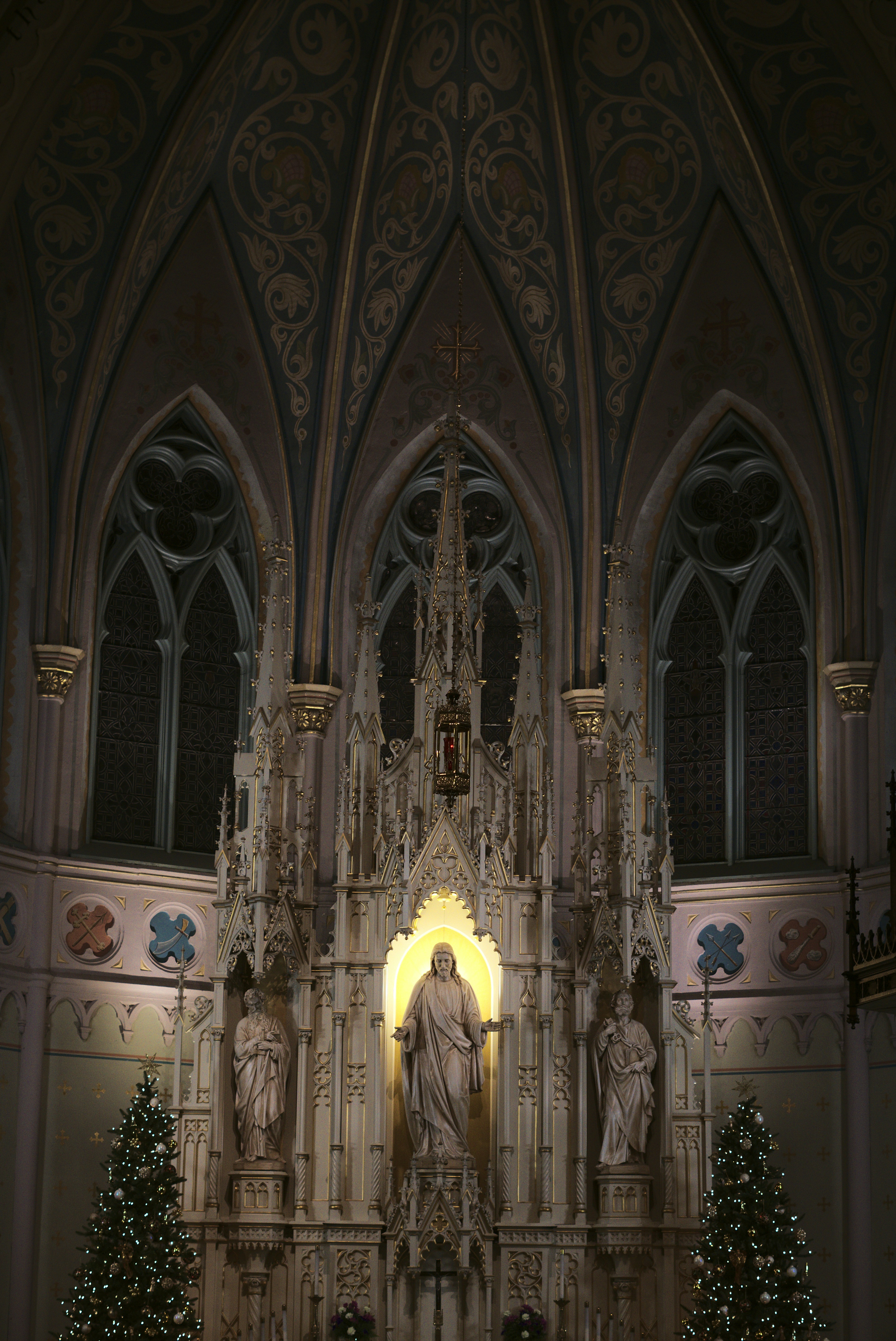 Luminous Shrine: Central Christ Figure Framed by Gothic Archways